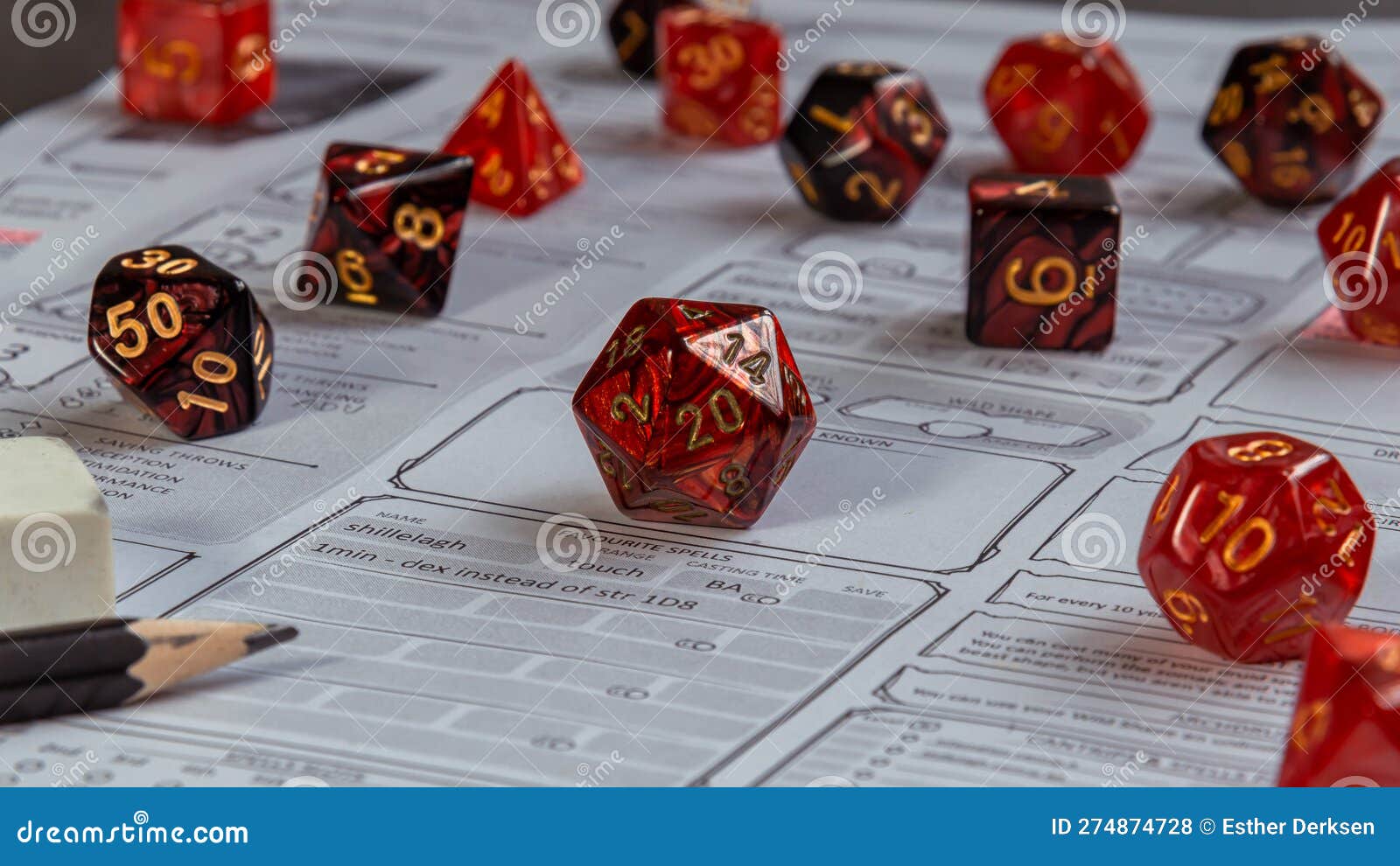 A Set of Red RPG Gaming Dice on a Character Sheet Stock Photo - Image ...