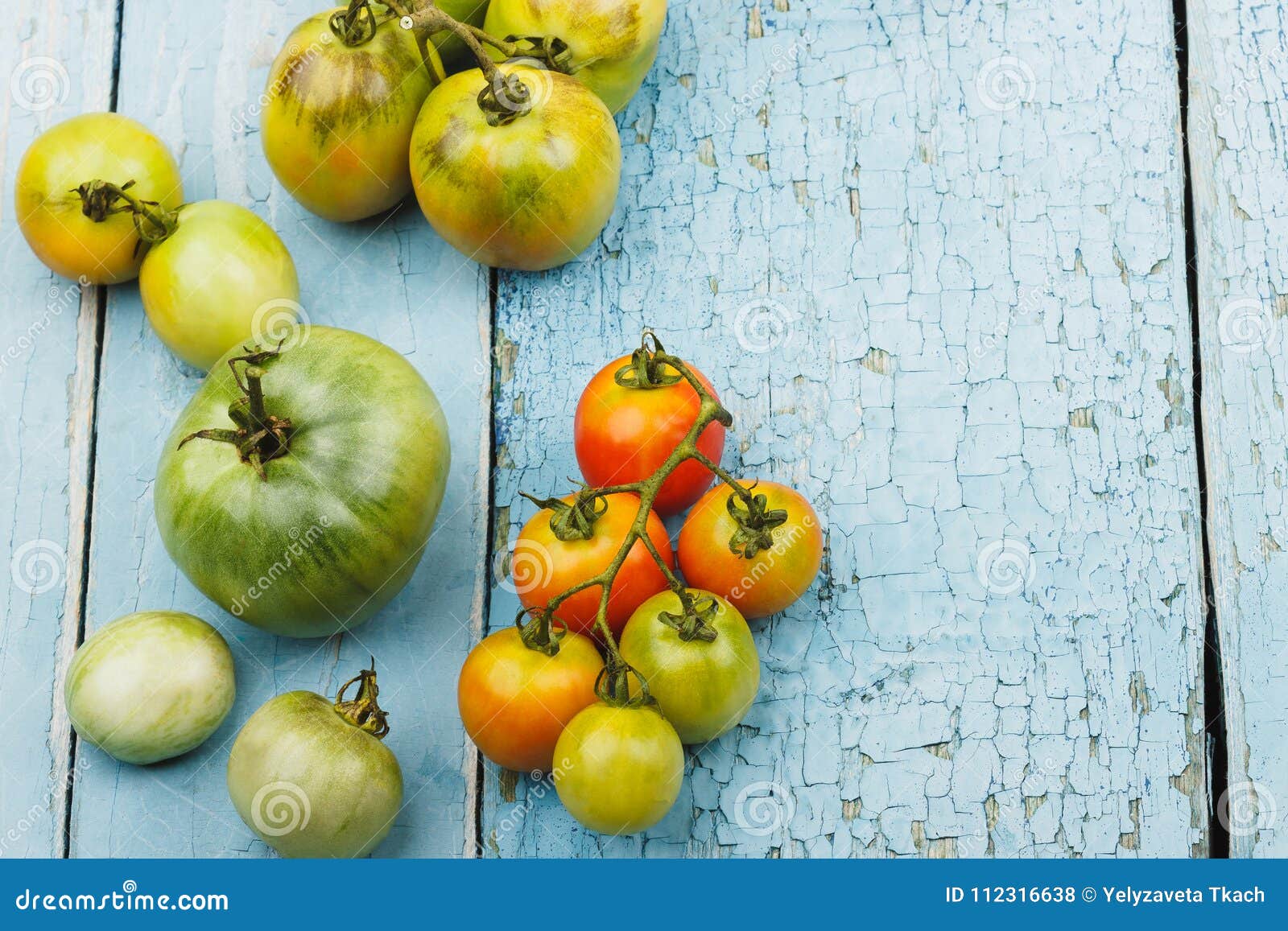 Set of Ripe Tomatoes on the Blue Wooden Background Stock Photo - Image ...