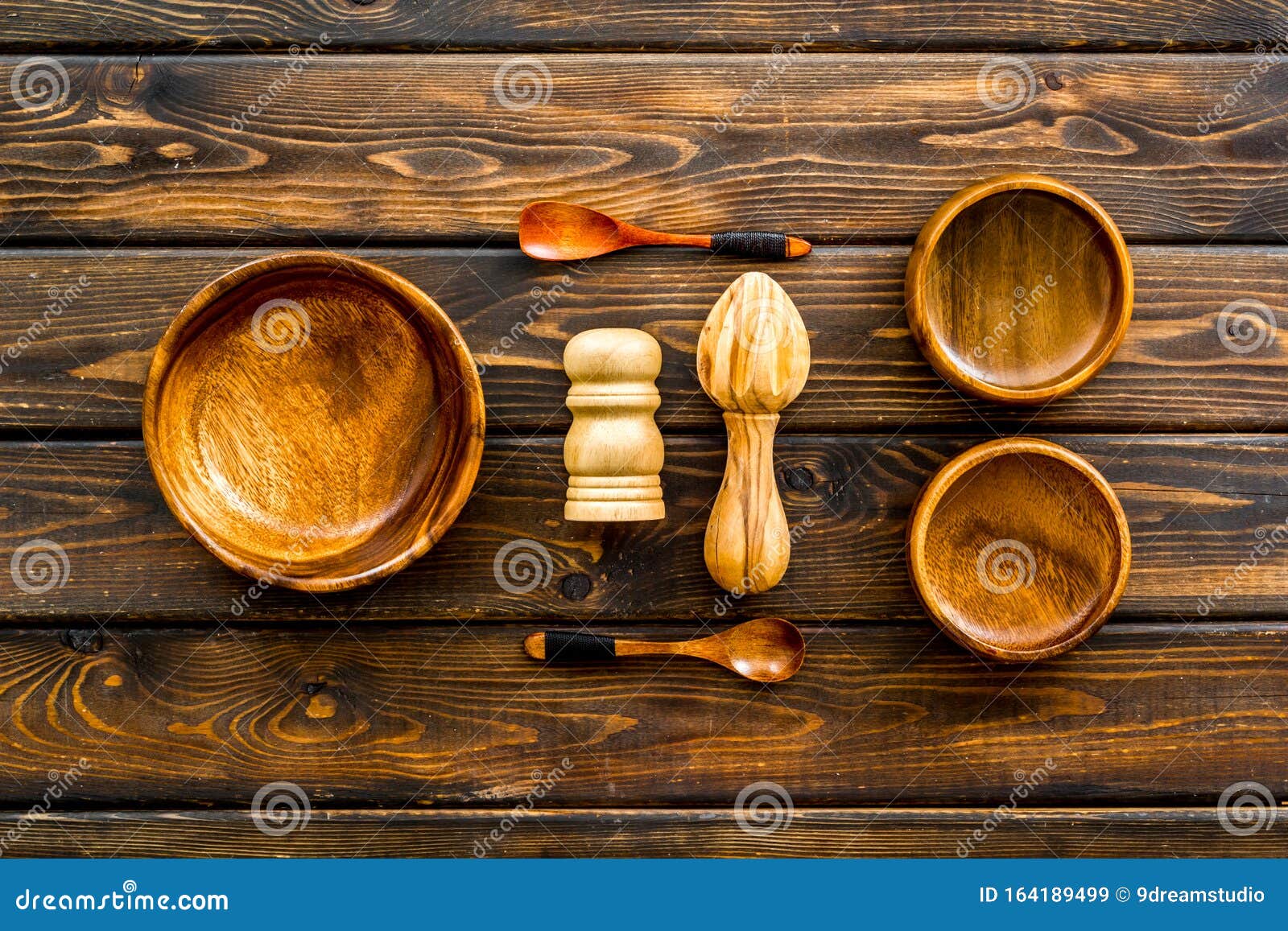 Set of Rustic Wooden Tableware - Bowls and Utensils on Dark Wooden ...