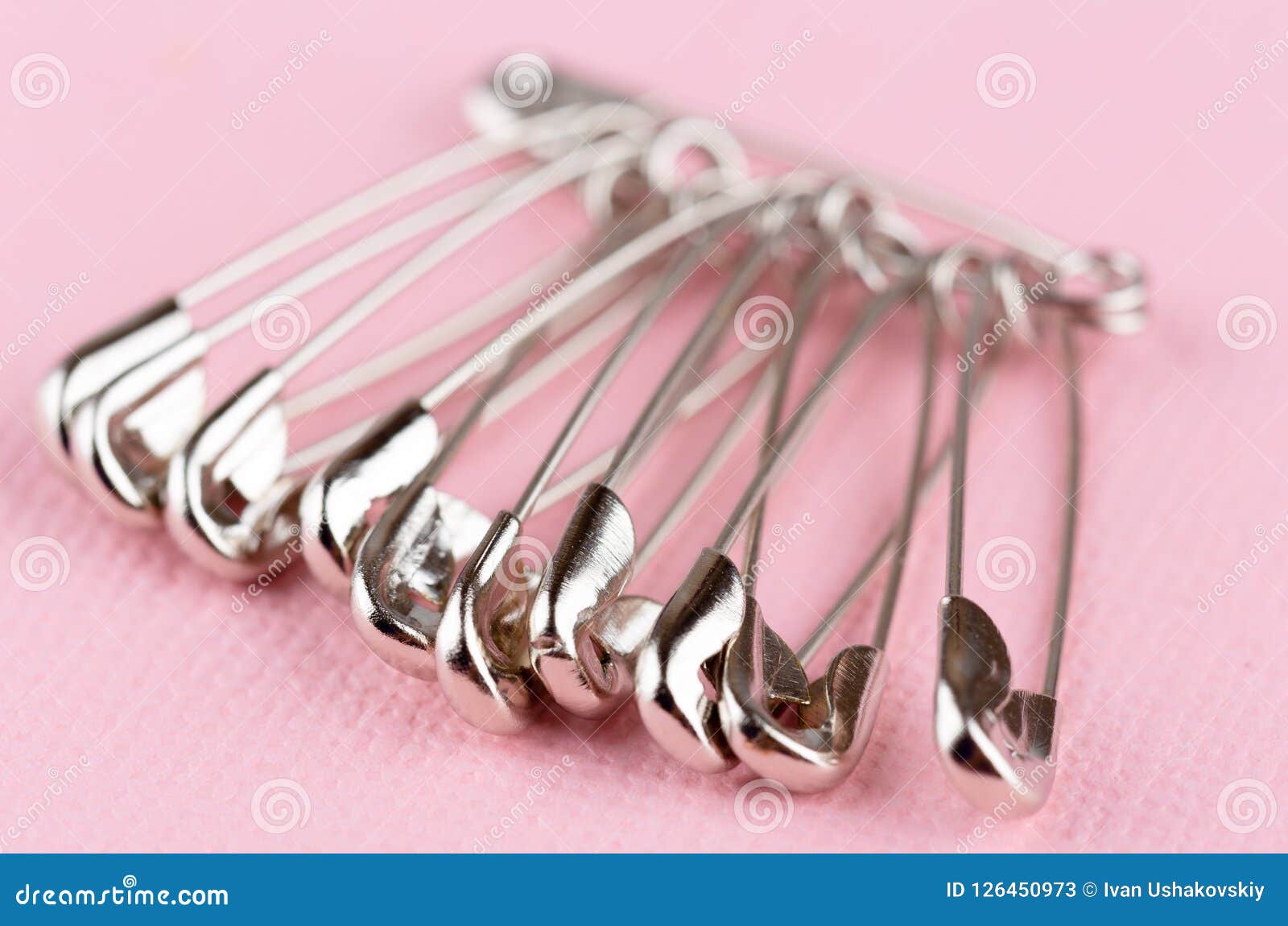 Set of Safety Pins Lying on Pink Paper Stock Image - Image of fancy ...