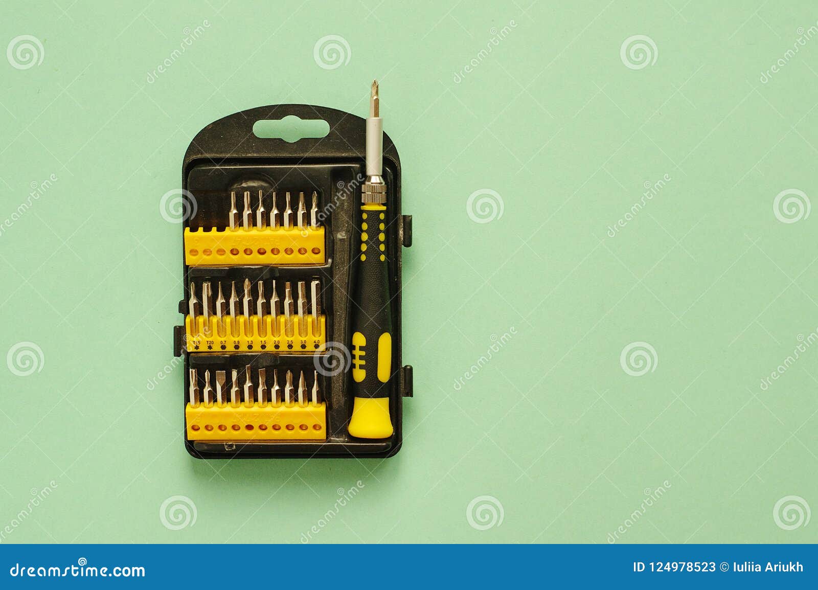 A Set of Screwdrivers for Precision Work on Green Background Stock ...