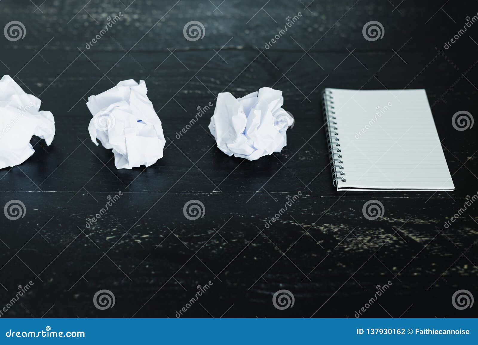 Set of Scrunched Paper Balls and Empty Notepad on Dark Moody Background ...