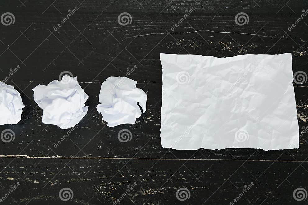 Set of Scrunched Paper Balls and Empty Torn Sheet on Dark Moody ...