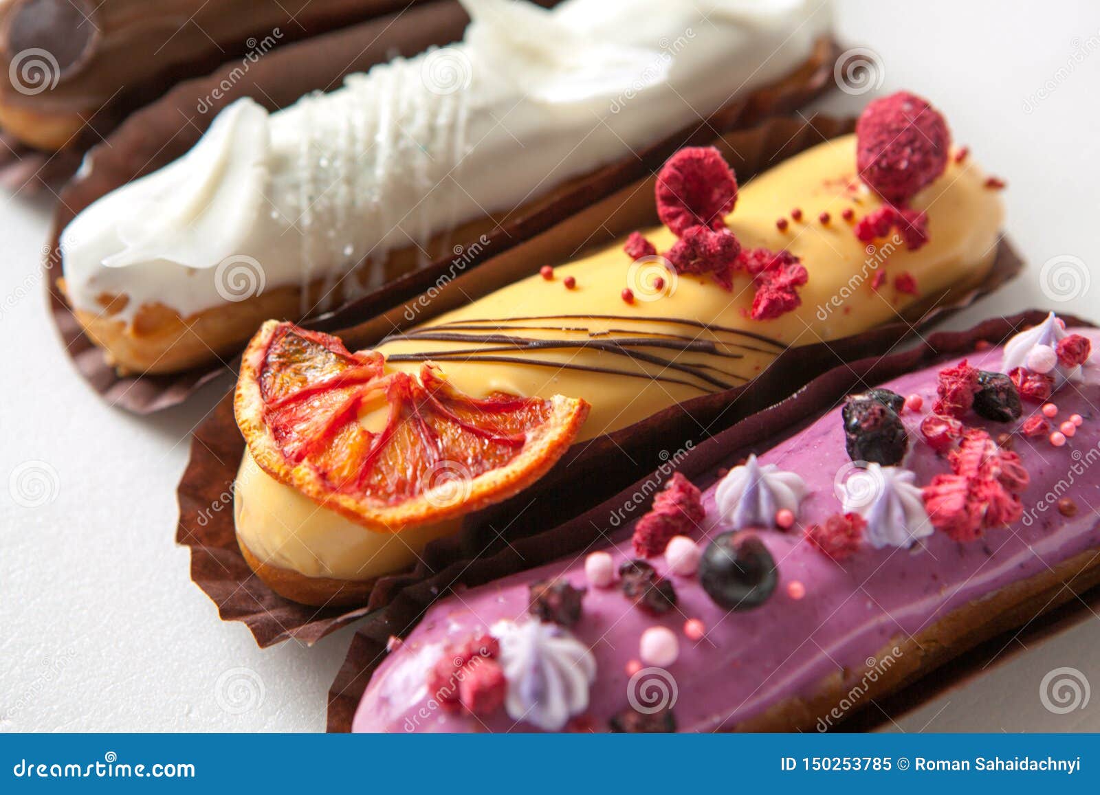 Set of Several Eclairs with Various Fillings and Design Isolate on a ...