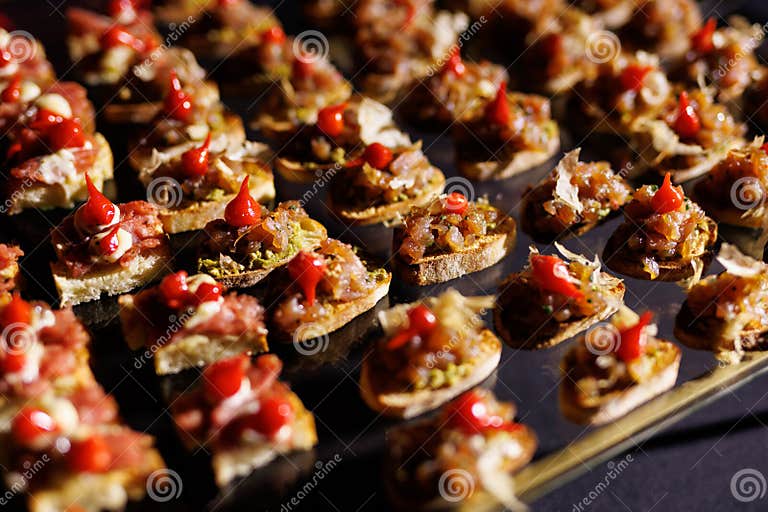 A Set of Small Different Snacks. Bite-sized Catering Canapes Stock ...