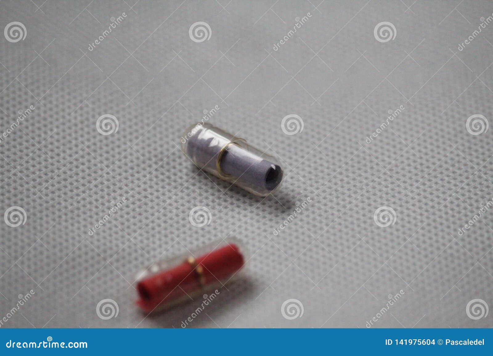 Small Notes in Capsules stock photo. Image of capsule - 141975604
