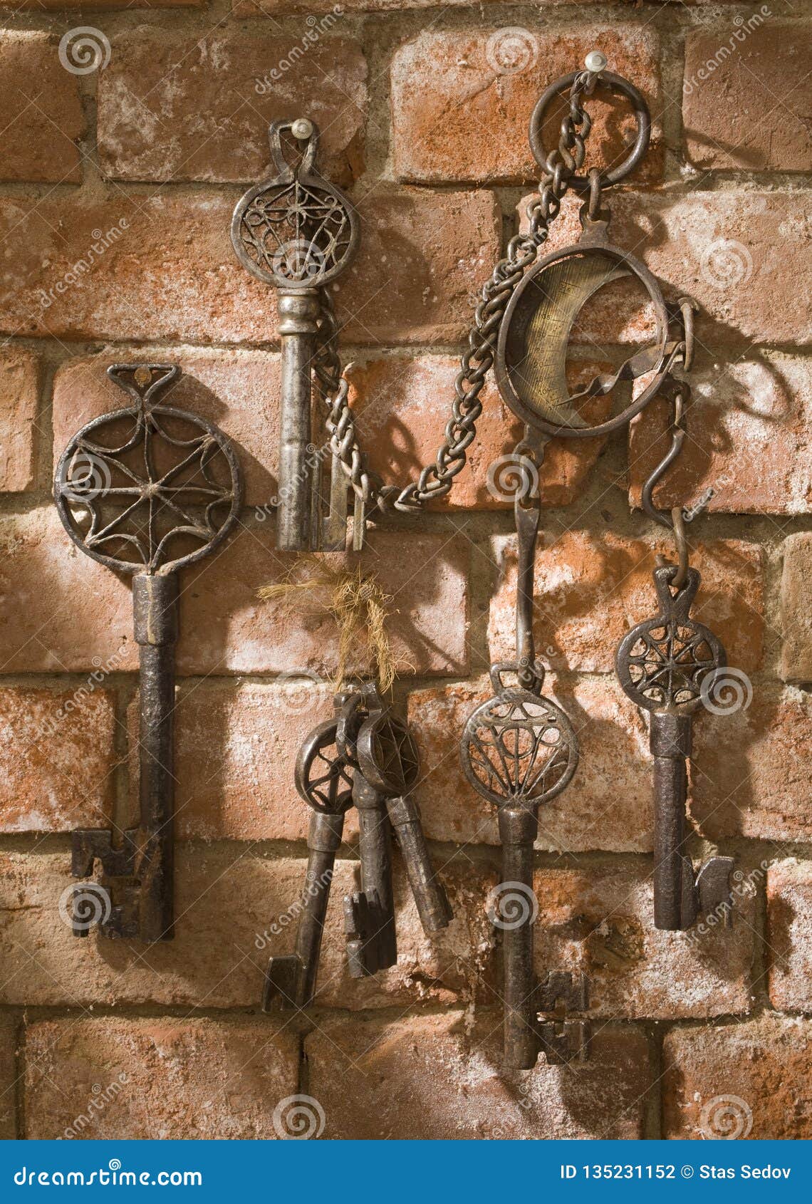 Set of Solar Keys on a Brick Wall Stock Photo - Image of chain, chest ...