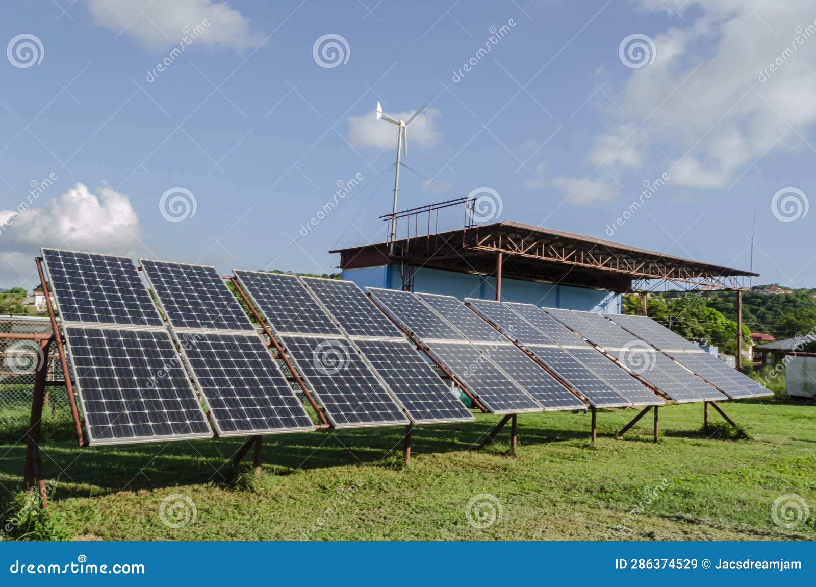 Solar Panels and Wind Mill stock image. Image of panel - 286374529