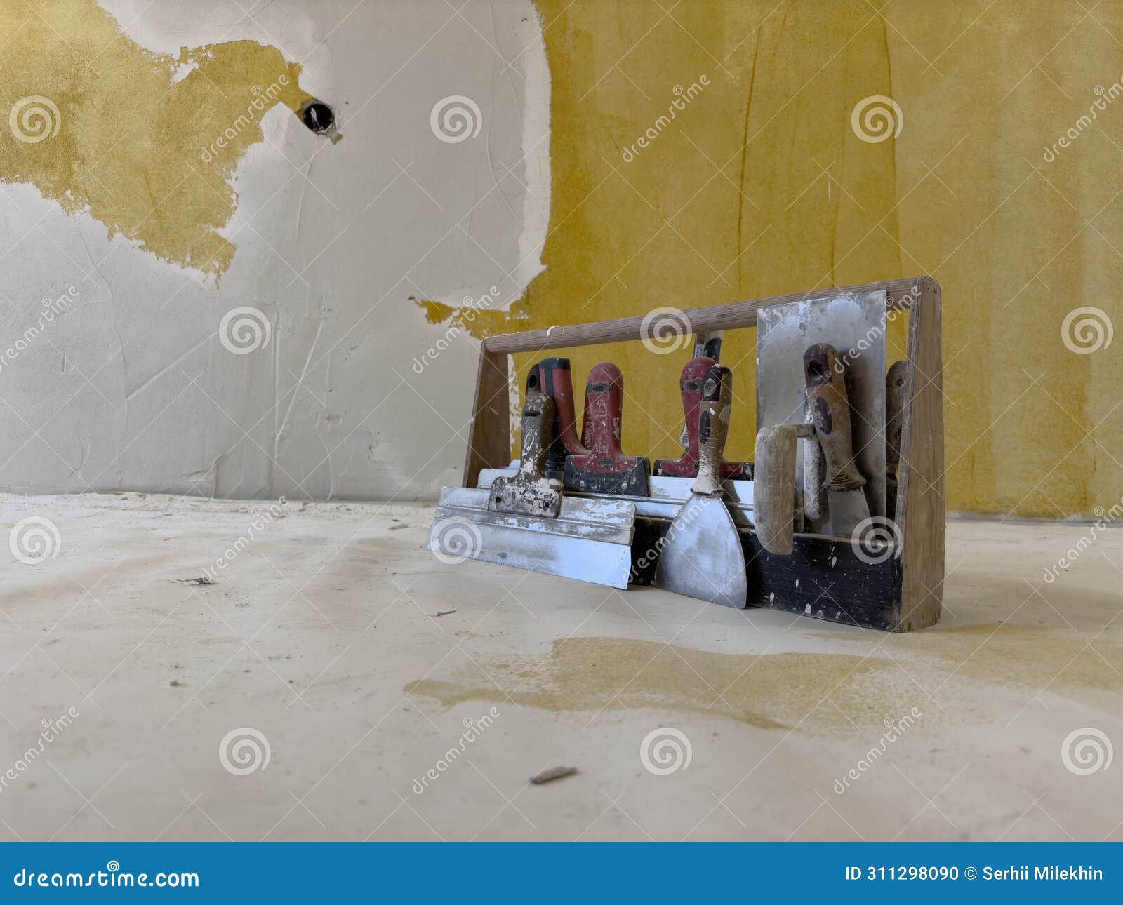 Set of Spatulas on the Background of an Old Wall. Plasterwork and ...