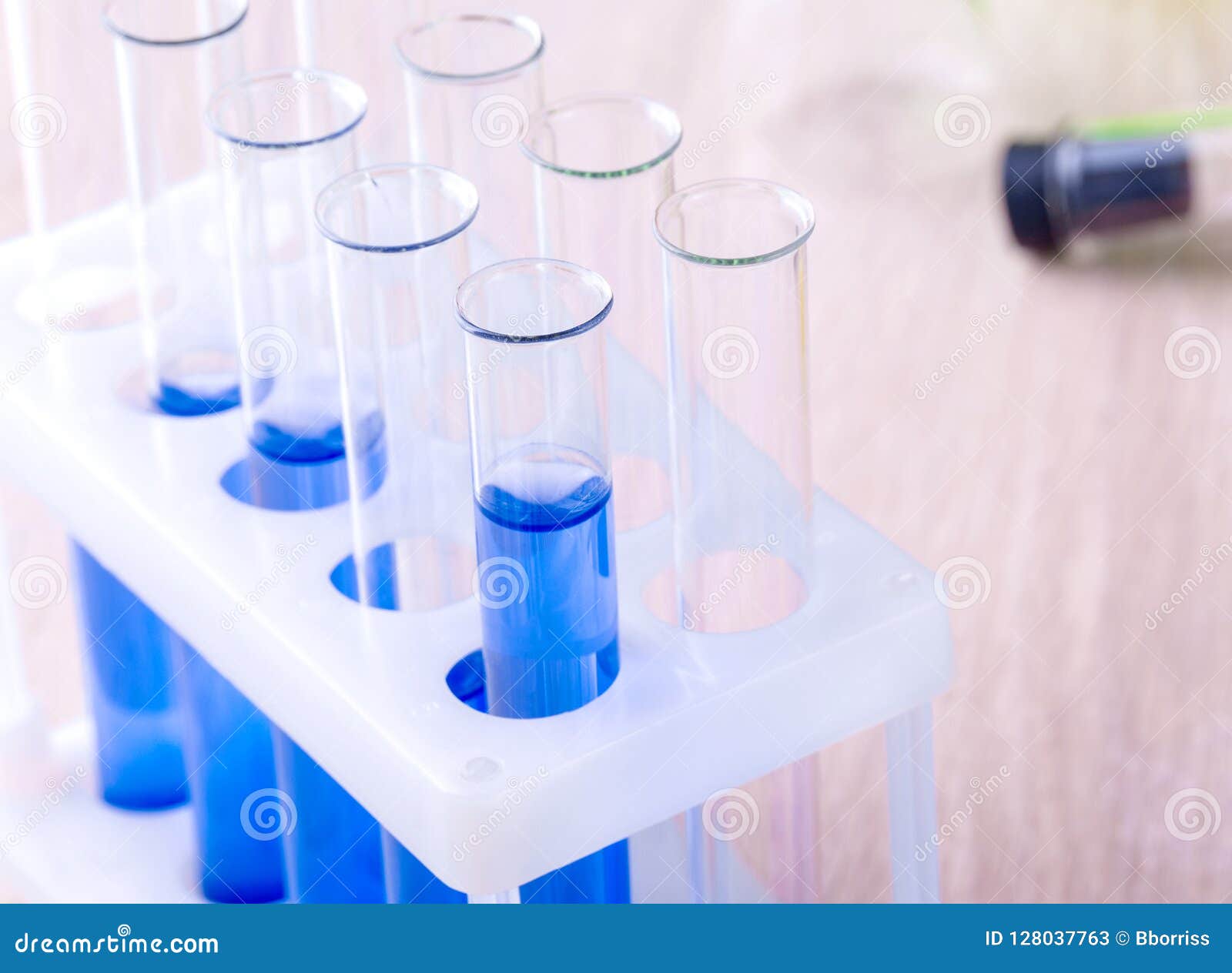 Set of Test Tubes with Blue Liquid on the Desktop. Stock Image - Image ...