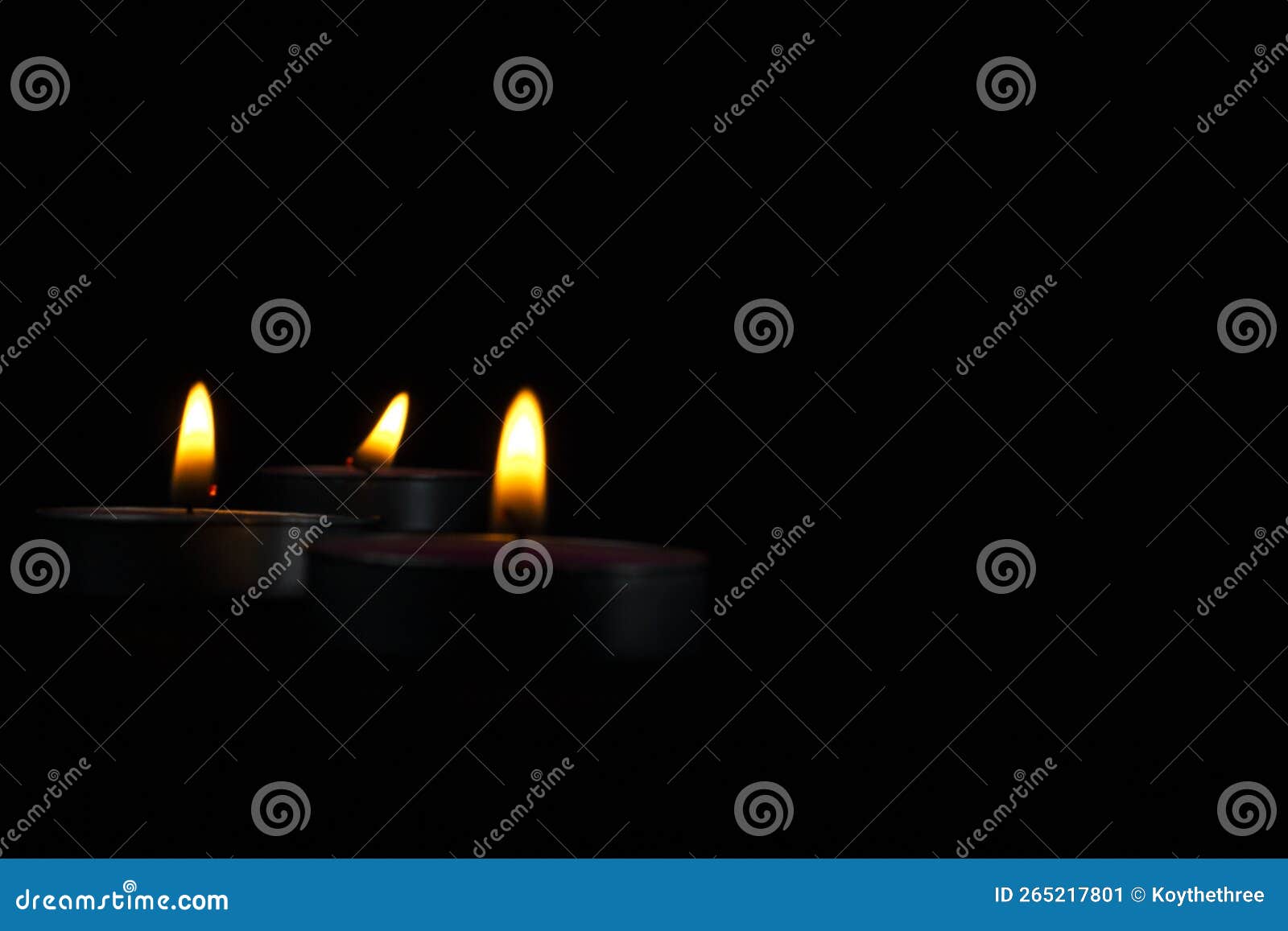 Set of Three Candles Lighting and Candle with Yellow Flame in the Dark ...
