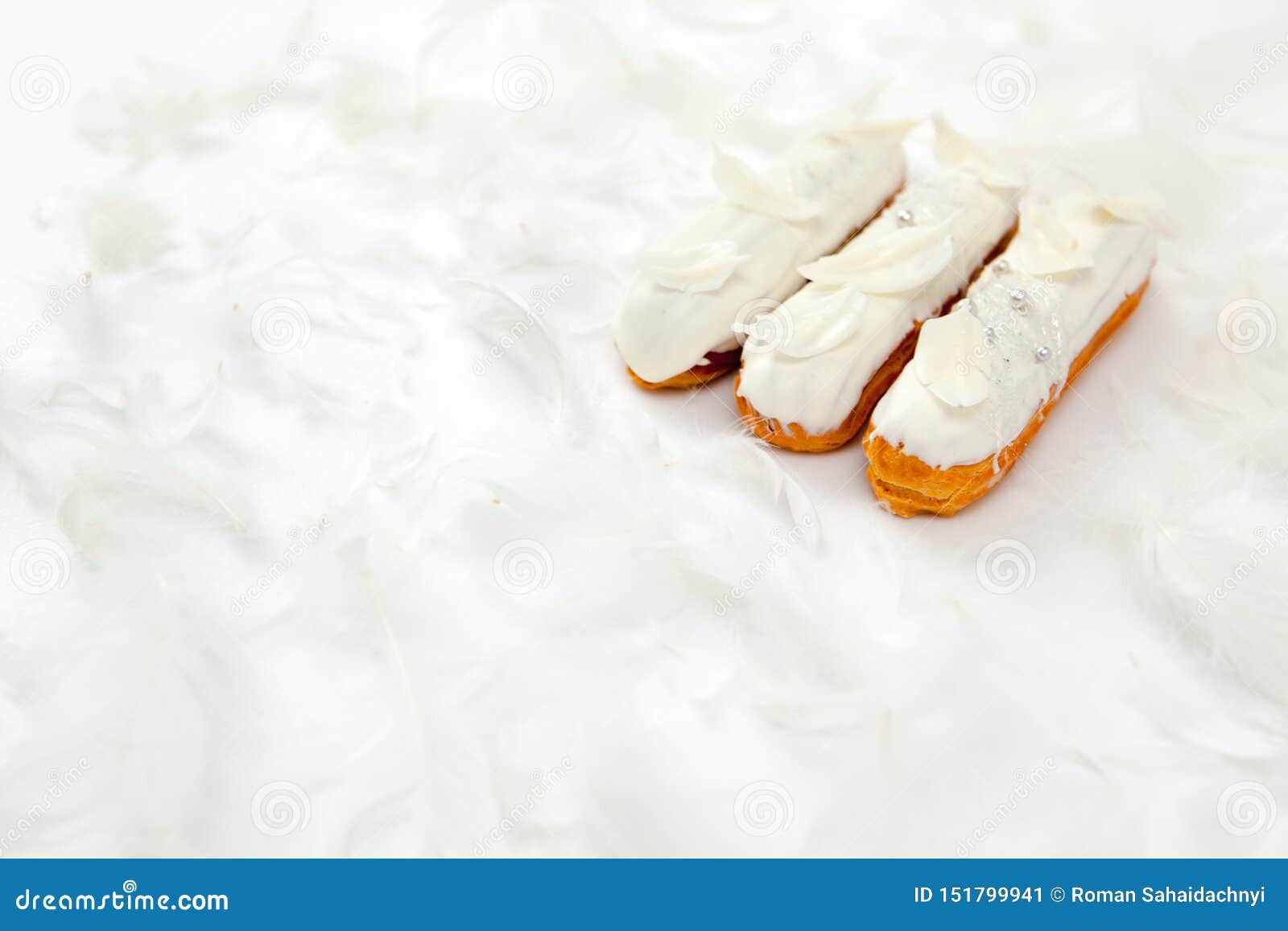 A Set of Three Eclairs with White Chocolate Decor Isolate on a White ...