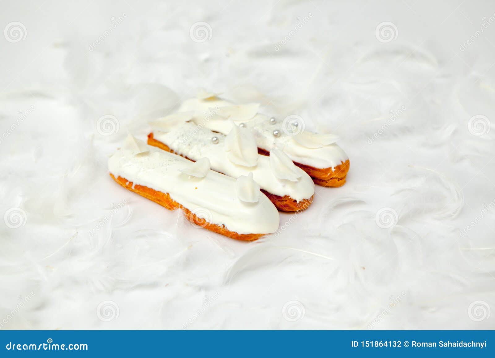 A Set of Three Eclairs with White Chocolate Decor Isolate on a White ...