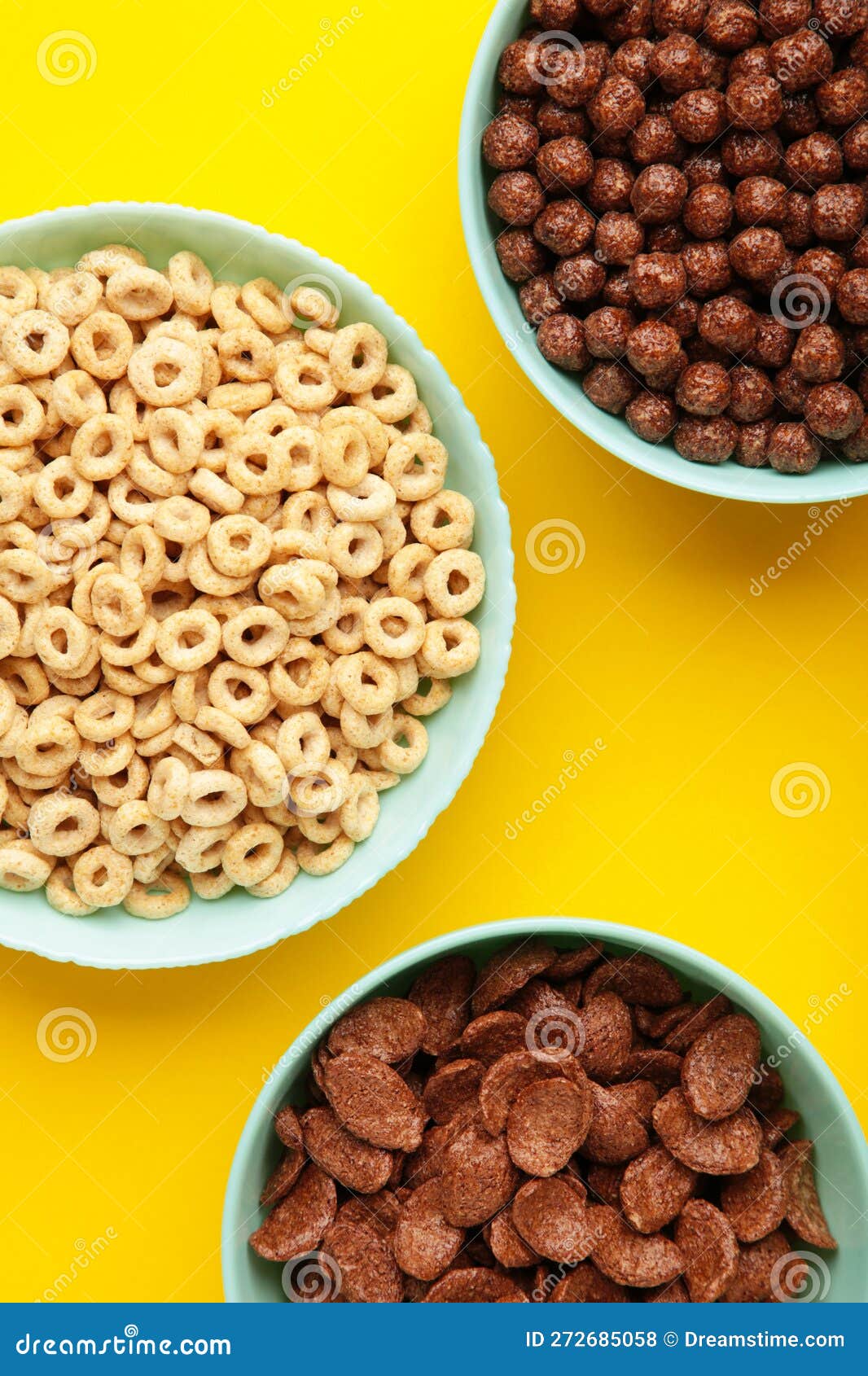 Set of Various Breakfast Cereals on Yellow Background. Vertical Photo ...