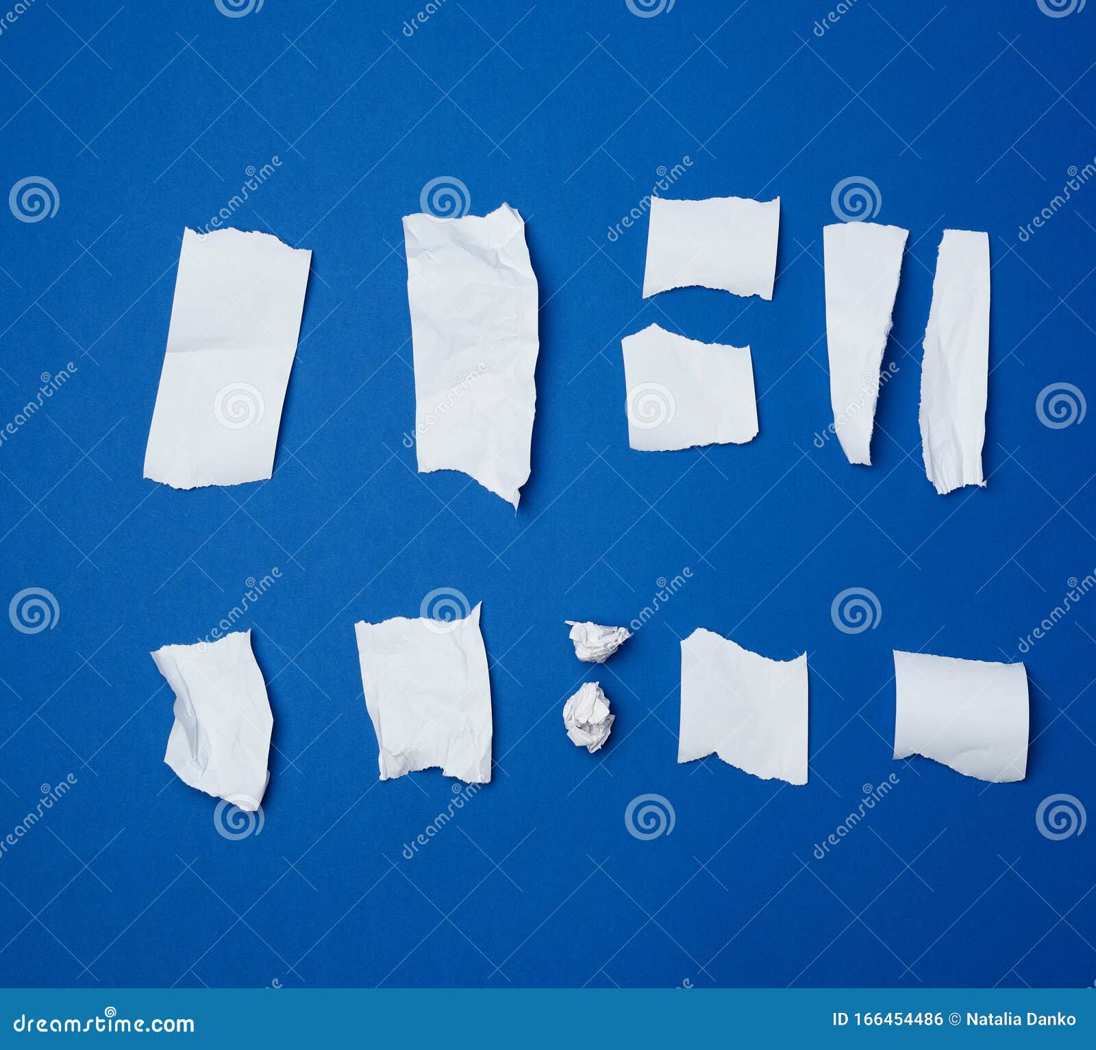 Set of Various Pieces of Torn White Crumpled Paper on a Blue Background ...