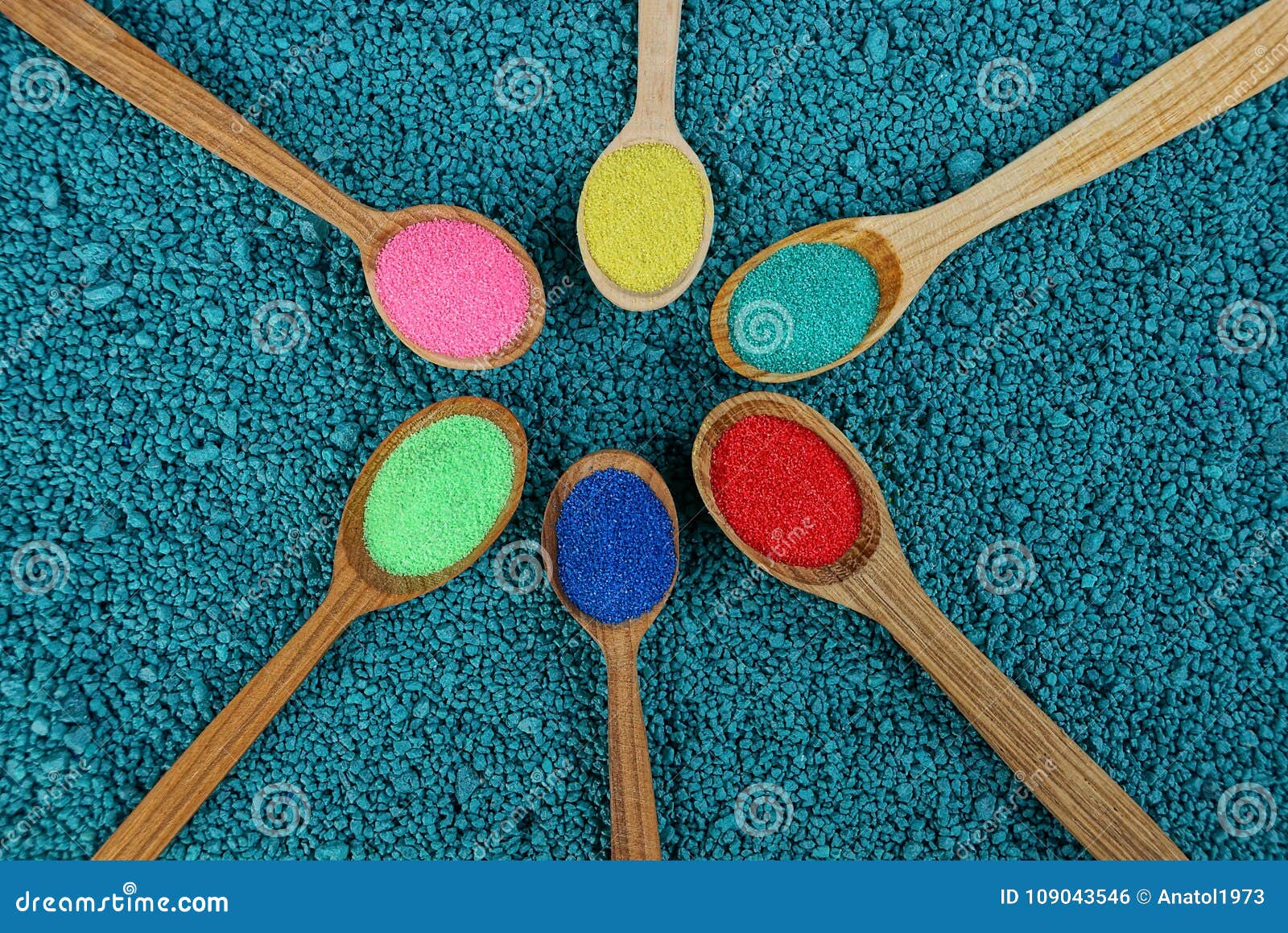 Set of Wooden Spoons with Colored Sand on Blue Stones Stock Photo ...