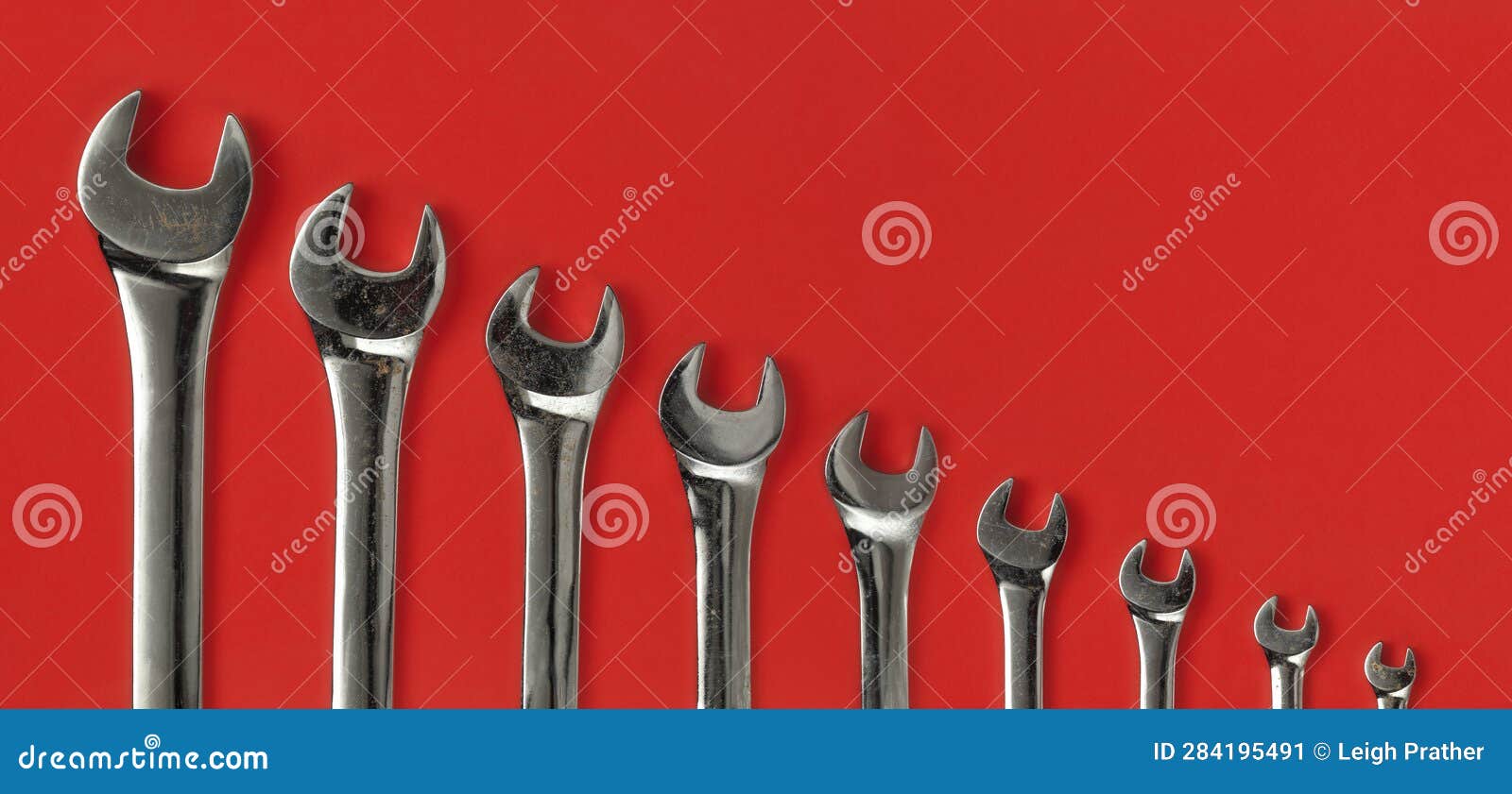 Set of Worn and Used Wrenches Lined Up on Red Background Stock Image ...