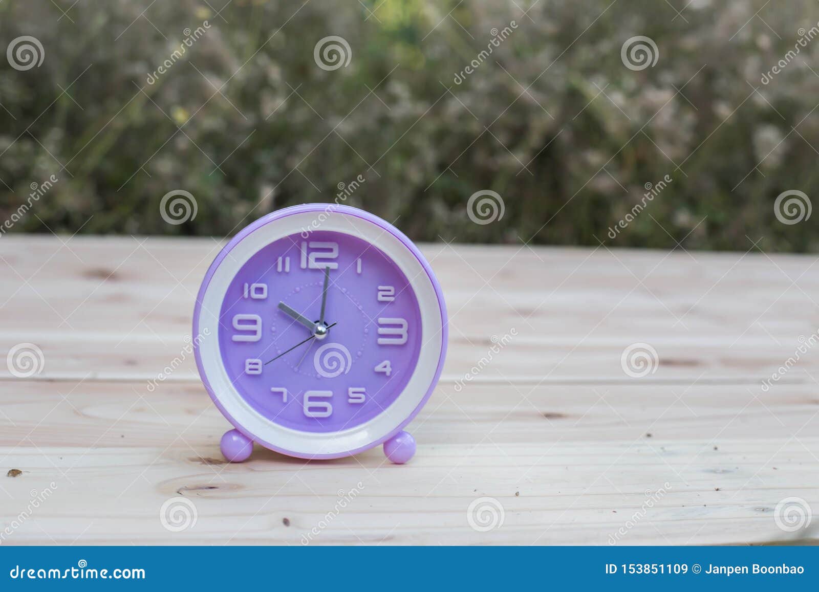 Set Your Clocks Back with this Clock in Grass Against a Bright Daylight ...