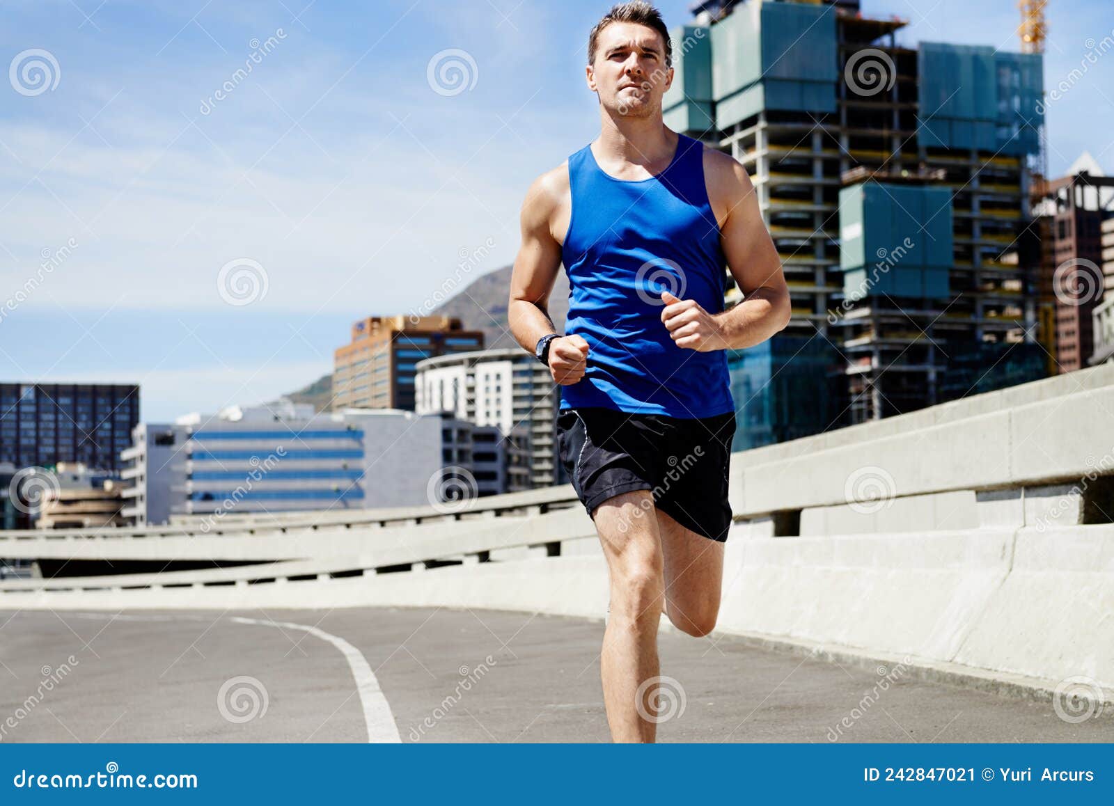 He Sets the Pace. Young Man Keeping Fit by Going for a Run in the City ...