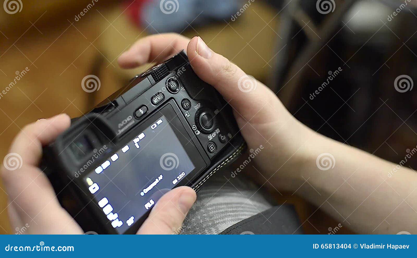 She Sets Up the Camera before Shooting. Man Turns the Wheels of the ...