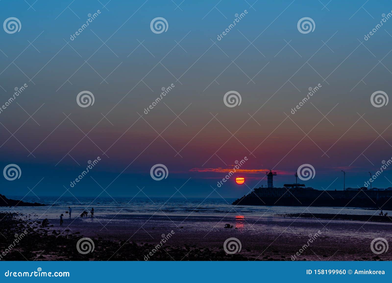 Setting Sun Behind Lighthouse Stock Photo - Image of coast, casting ...