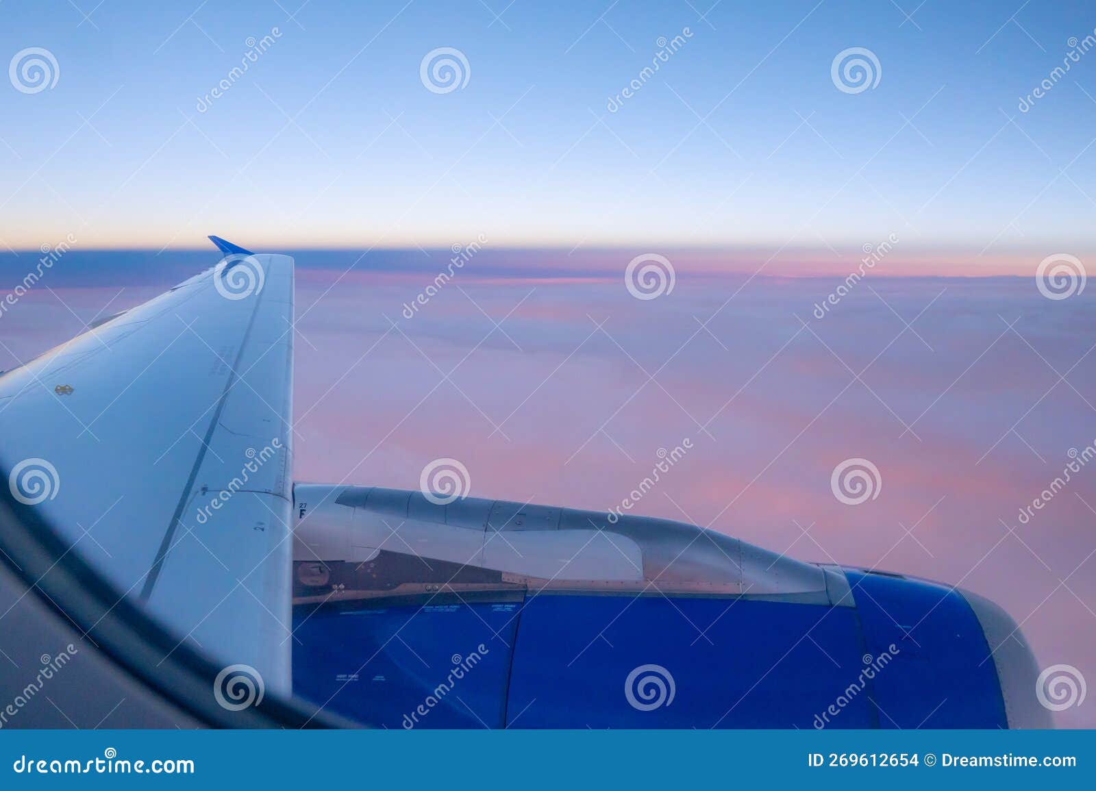 Sunset Seen from an Airplane Window, with a View Over the Wing and ...