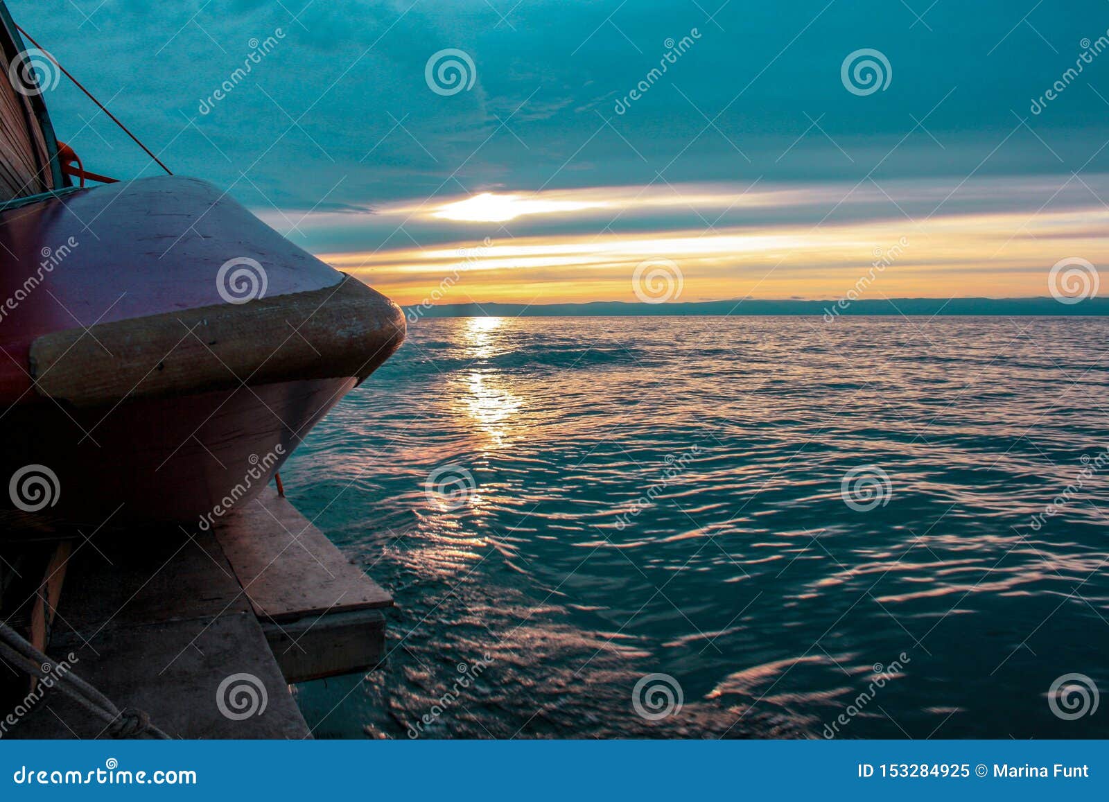 The Setting Sun Illuminates the Blue Water of the Lake. Stock Image ...