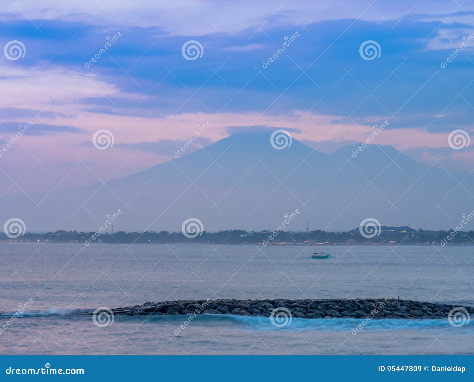 Ocean sunset with Volcano stock image. Image of indonesian - 95447809