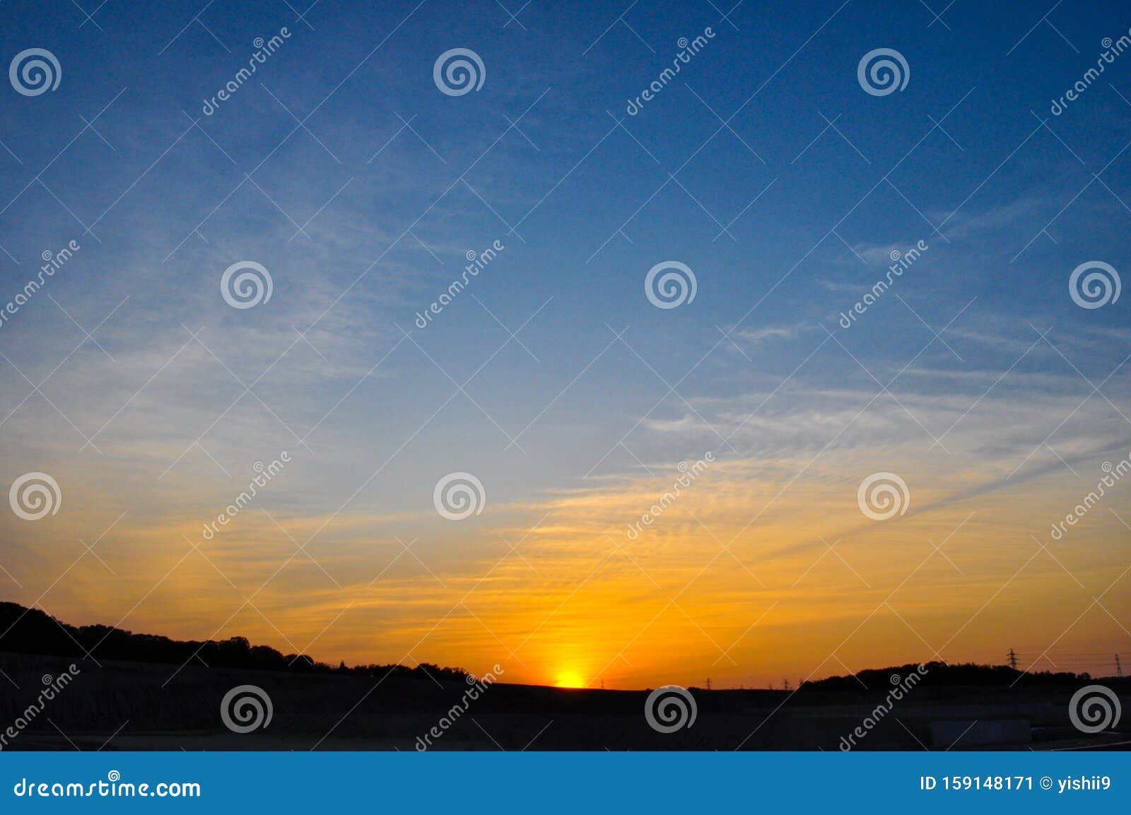Setting sun over the hills stock image. Image of color - 159148171
