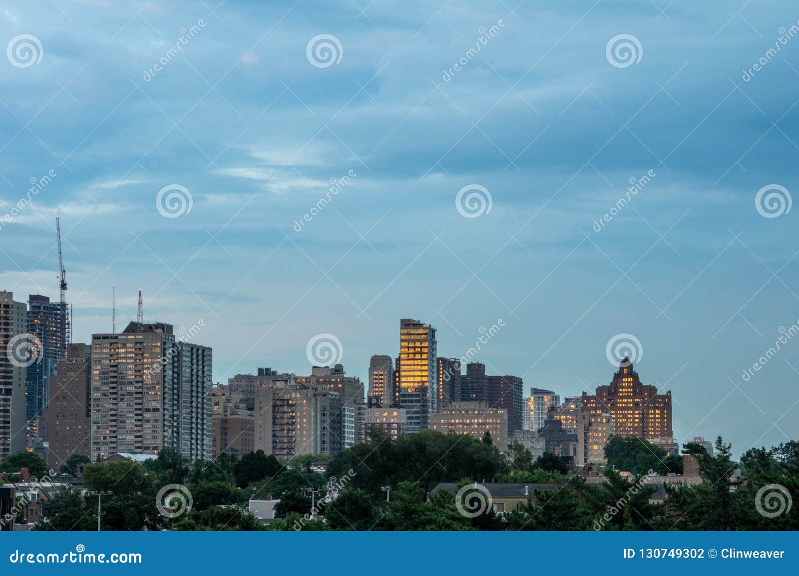 Setting Sun Reflected in City Skyline Stock Photo - Image of ...