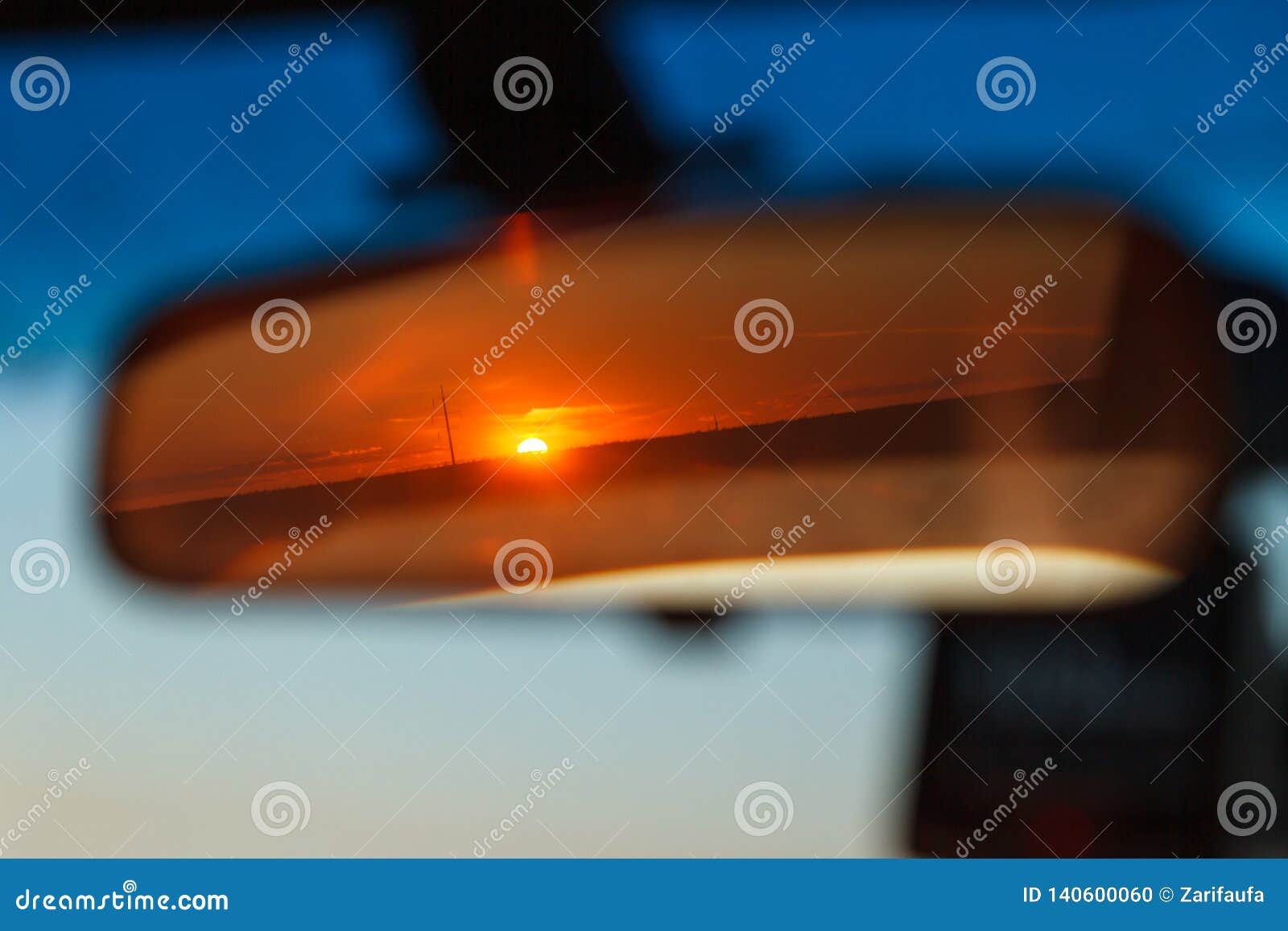 Setting Sun Reflecting in Rearview Mirror Stock Photo - Image of summer ...