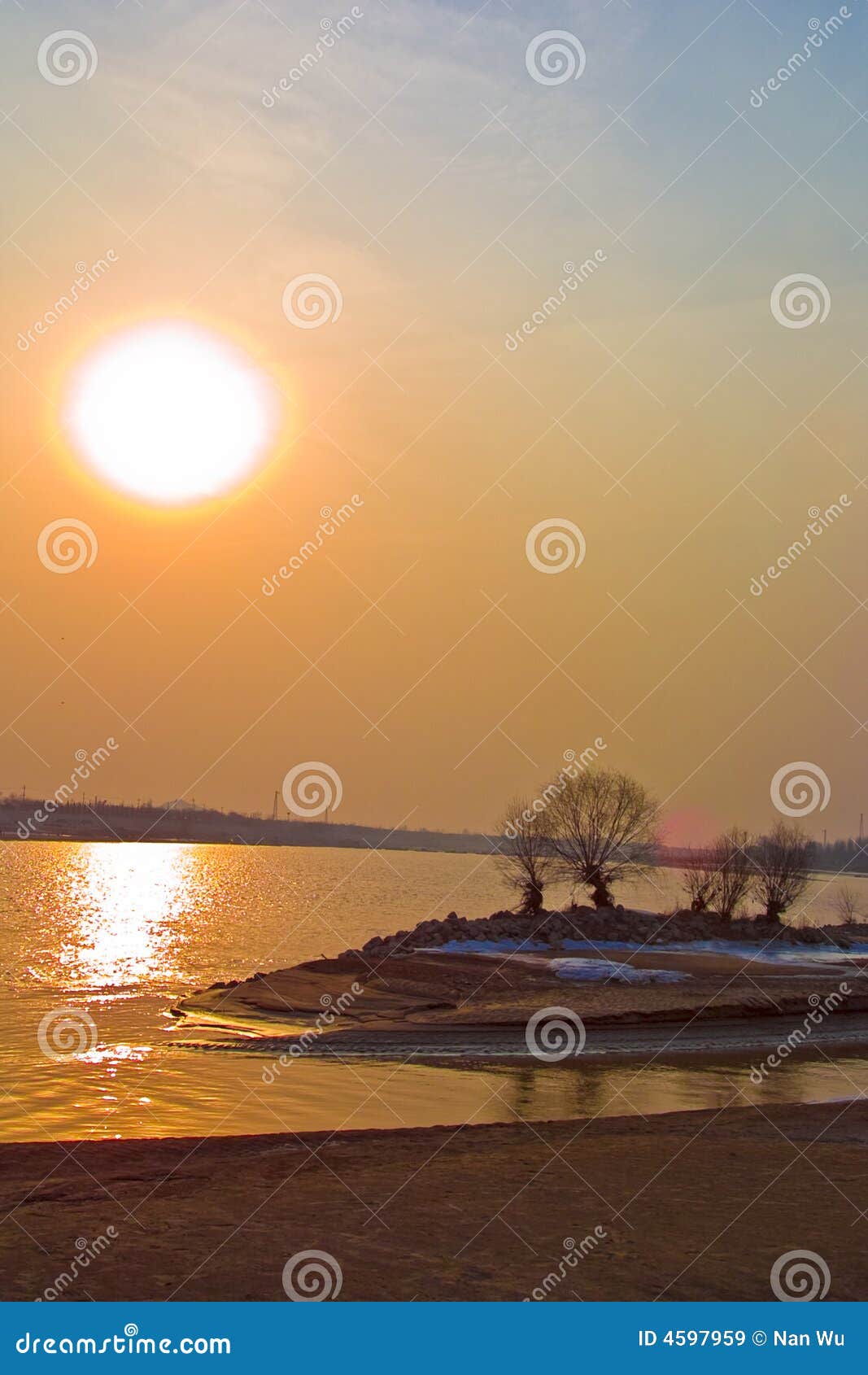Setting Sun and Sand Beach stock image. Image of reflection - 4597959