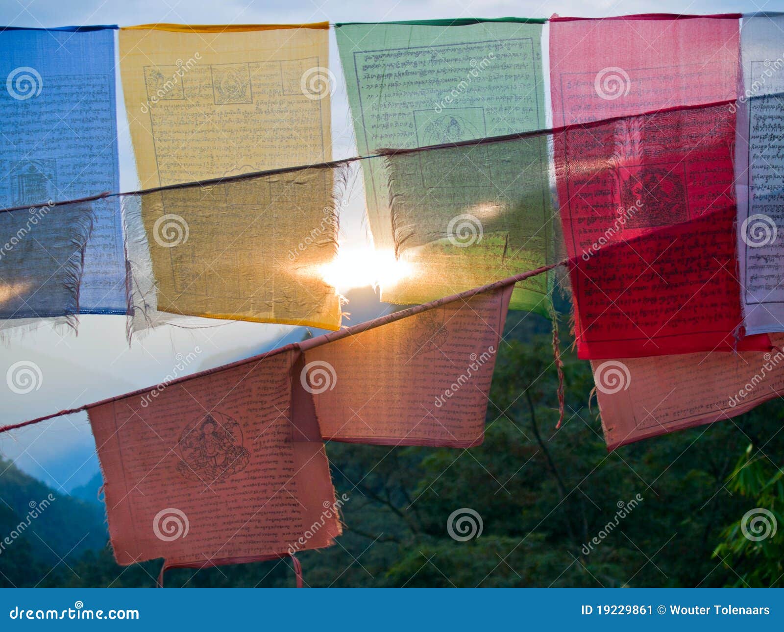 Setting Sun Shining through Prayer Flags Stock Image - Image of ...