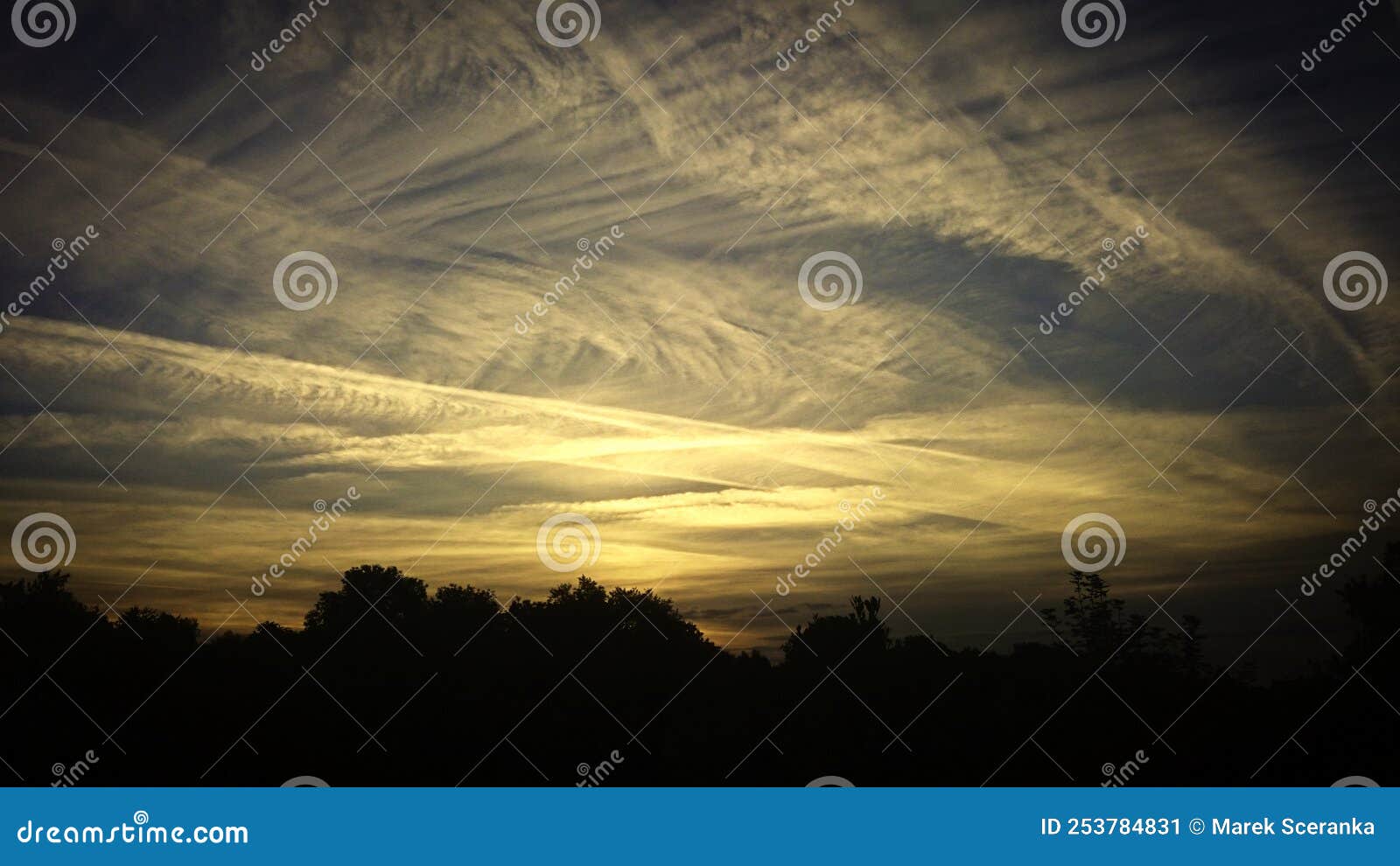 Setting Sun through Wispy Clouds Stock Image - Image of dusk, black ...
