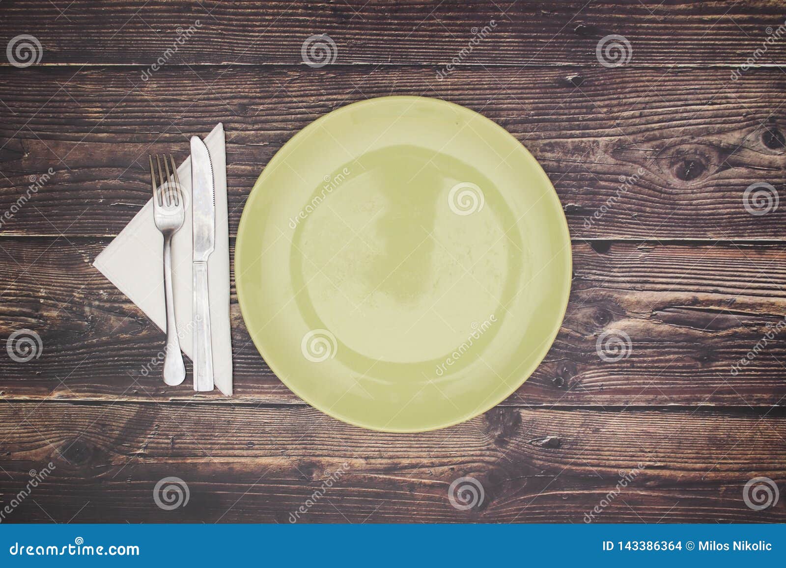 Setting Table for One Person with Green Plate Stock Photo - Image of ...