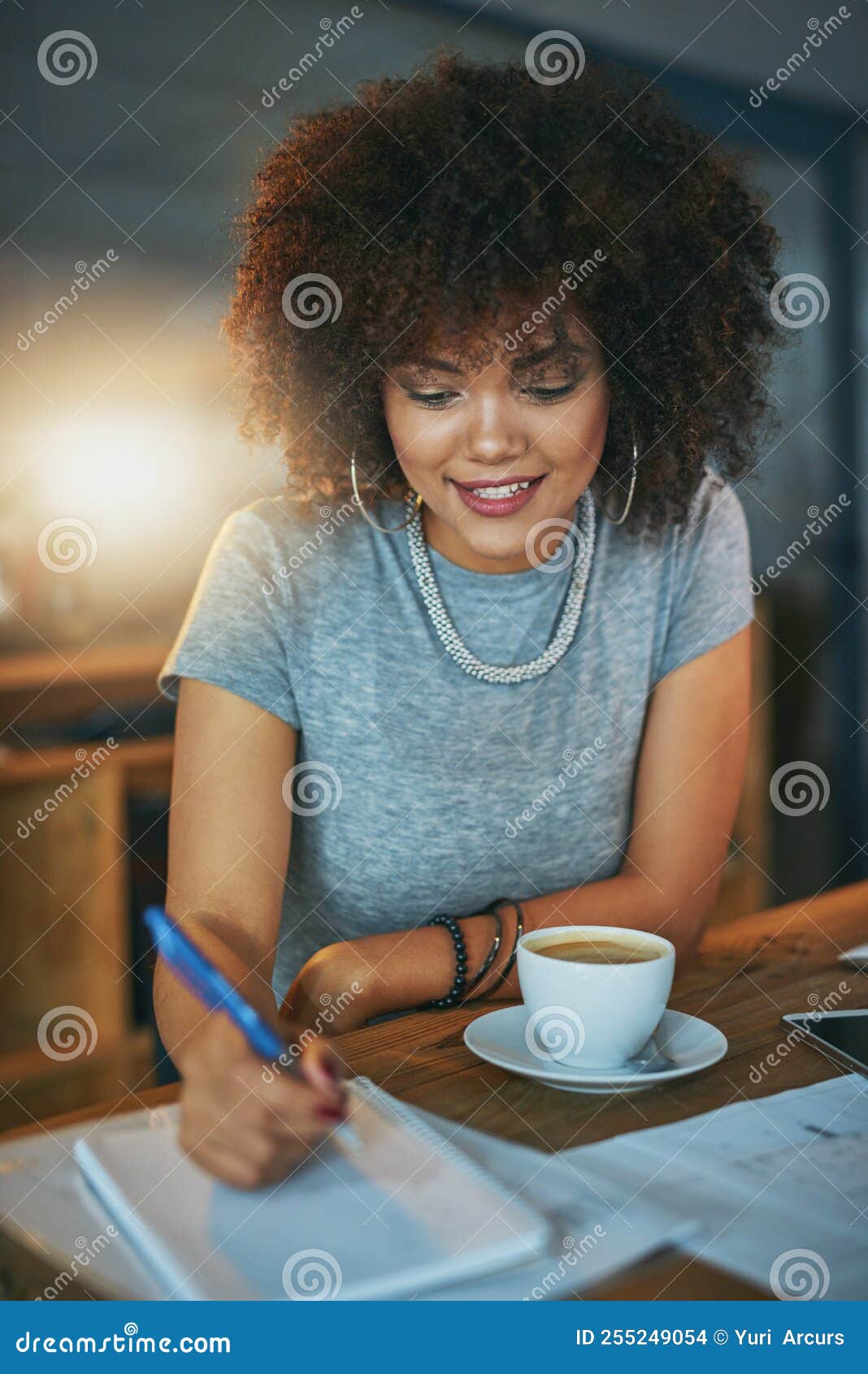 Setting Tasks for Tomorrows Work Day. a Young Woman Writing in a ...