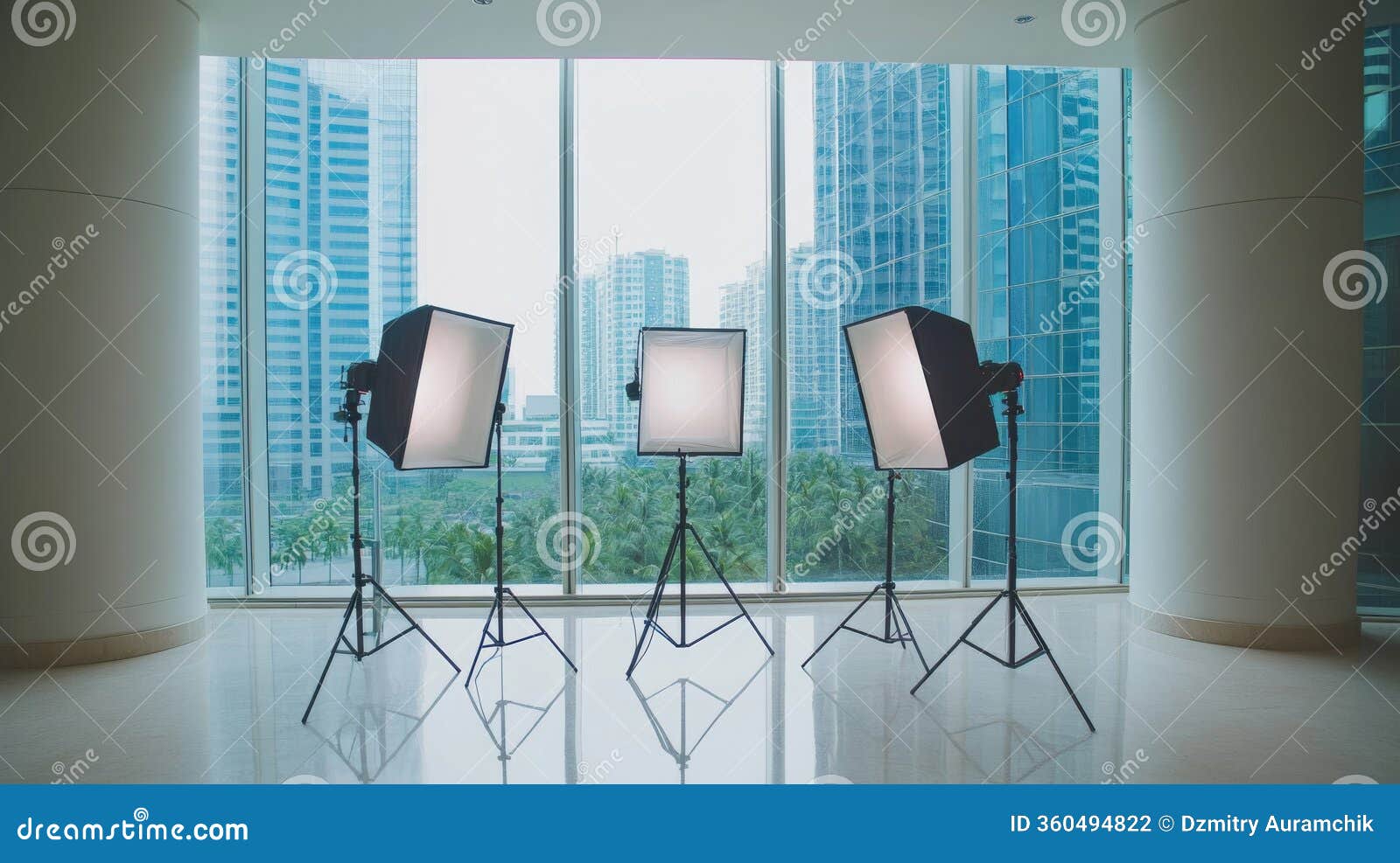 Setting Up a Photography Studio with Three Cameras and Lighting Stock ...