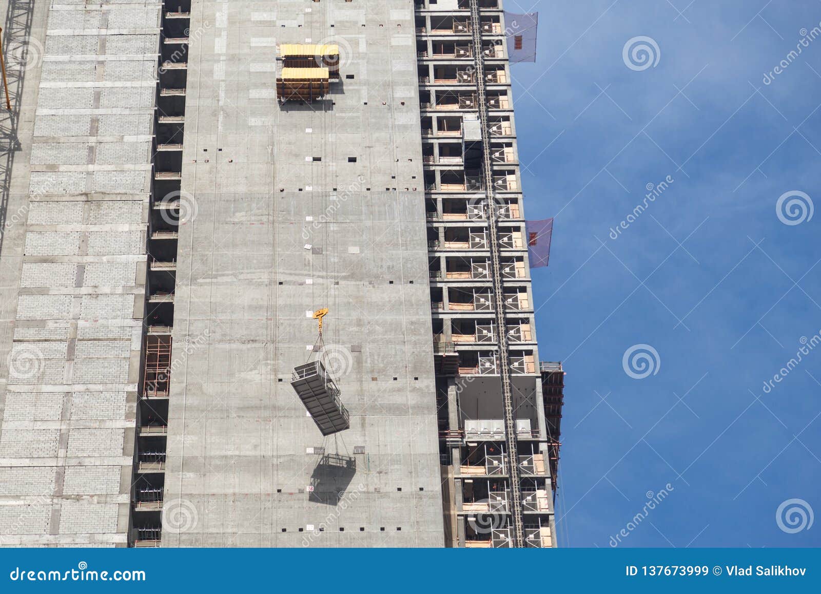 Setting Up a Tower Crane in the Construction Site. the Hoist Winch is ...