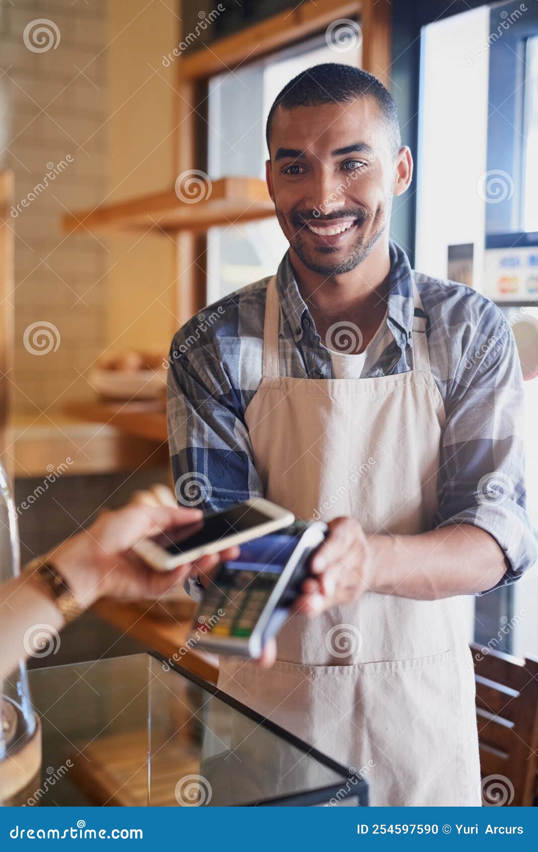 Settle Your Bill the Smart Way. a Waiter Processing a Payment from a ...