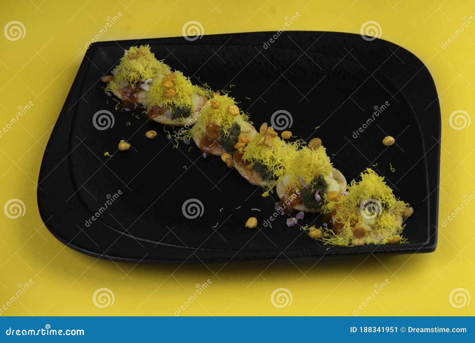 Sev Puri Indian Chat Dish Served on a Black Plate Stock Image - Image ...