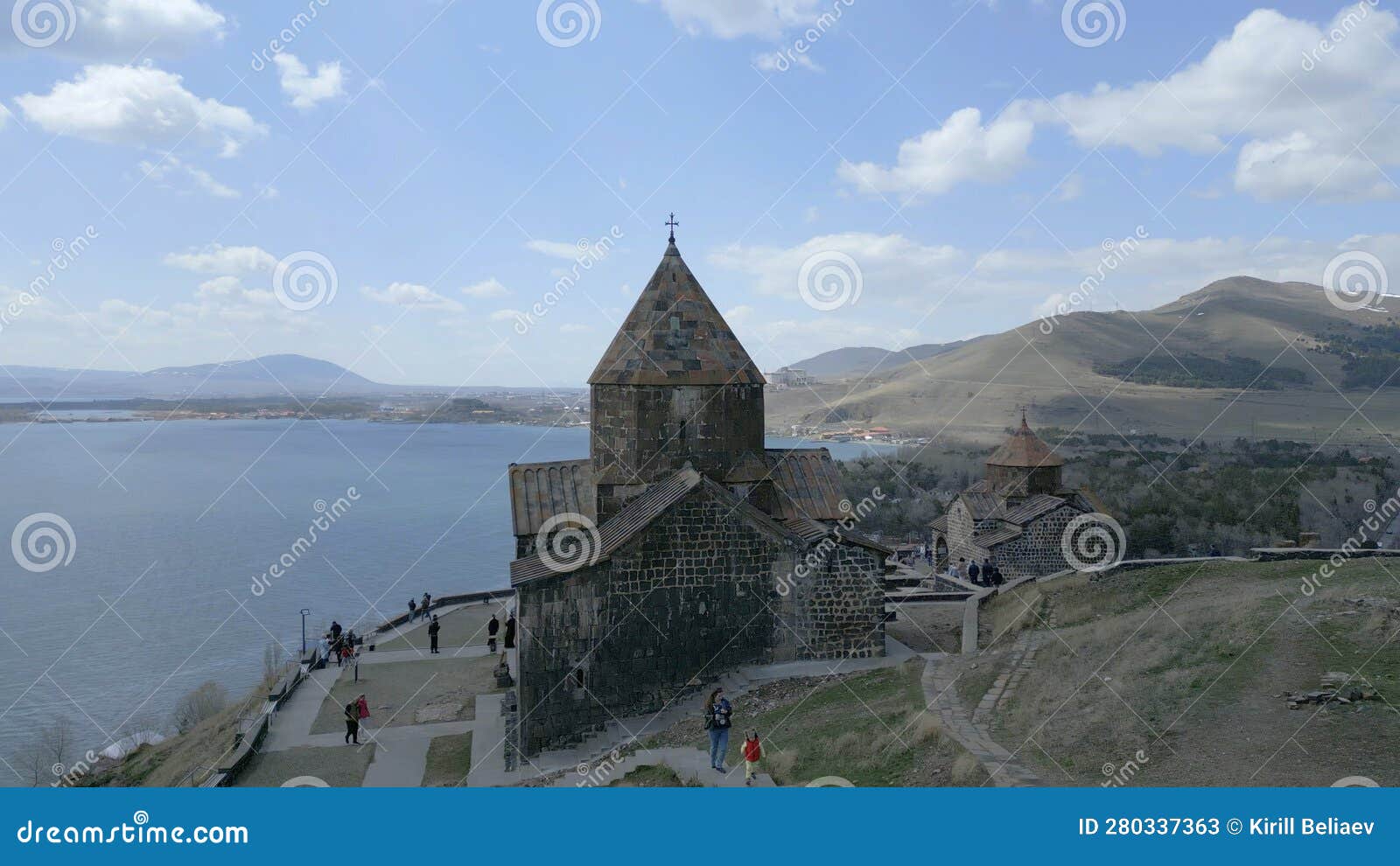 Sevan Monastery. Buildings, Lake Sevan, Mountains, Rocks, Grass, Sky, People Editorial Stock ...