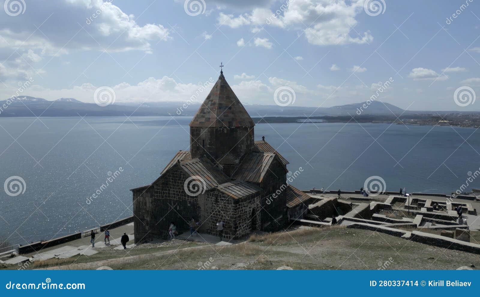 Sevan Monastery. Buildings, Lake Sevan, Mountains, Rocks, Grass, Sky, People Editorial Stock ...