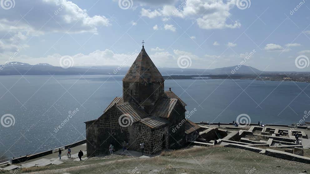 Sevan Monastery. Buildings, Lake Sevan, Mountains, Rocks, Grass, Sky, People Editorial Stock ...