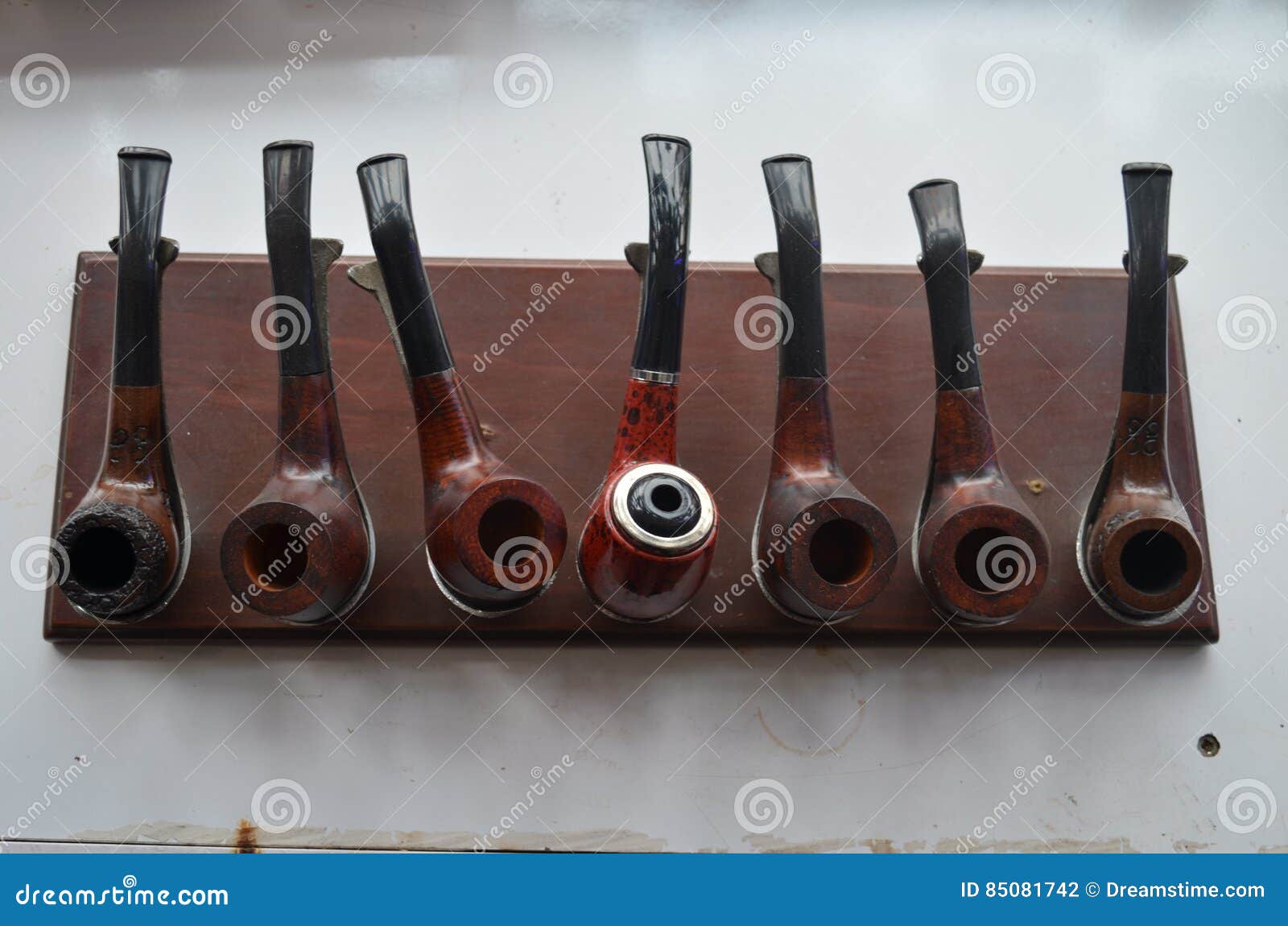 Seven Pipes on a Pipes` Stand on the Table Stock Photo - Image of ...