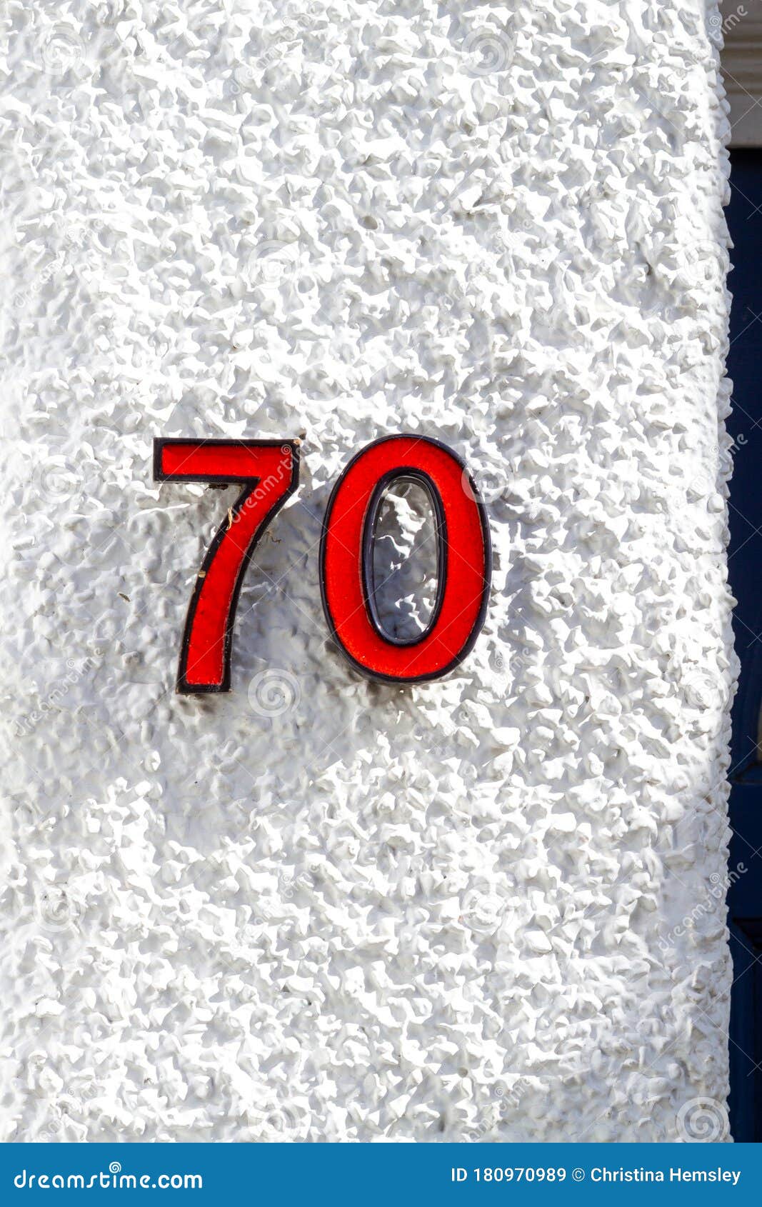 Bright Red Number 70 on a Wall Stock Image - Image of outside, house ...