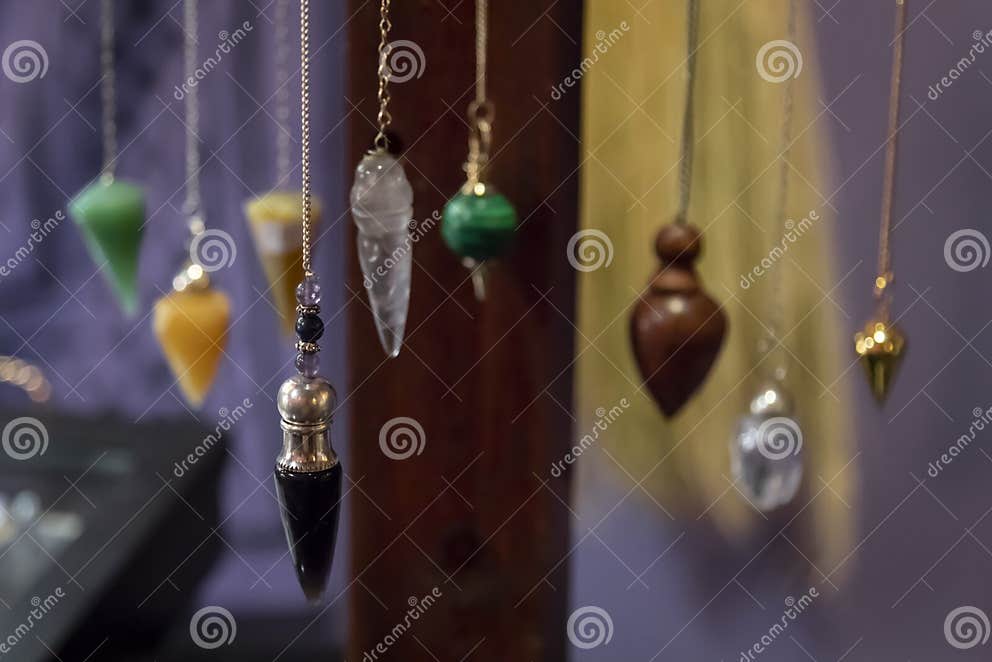 Several Beautiful Crystal Pendulums Hanging on Display Stock Photo ...