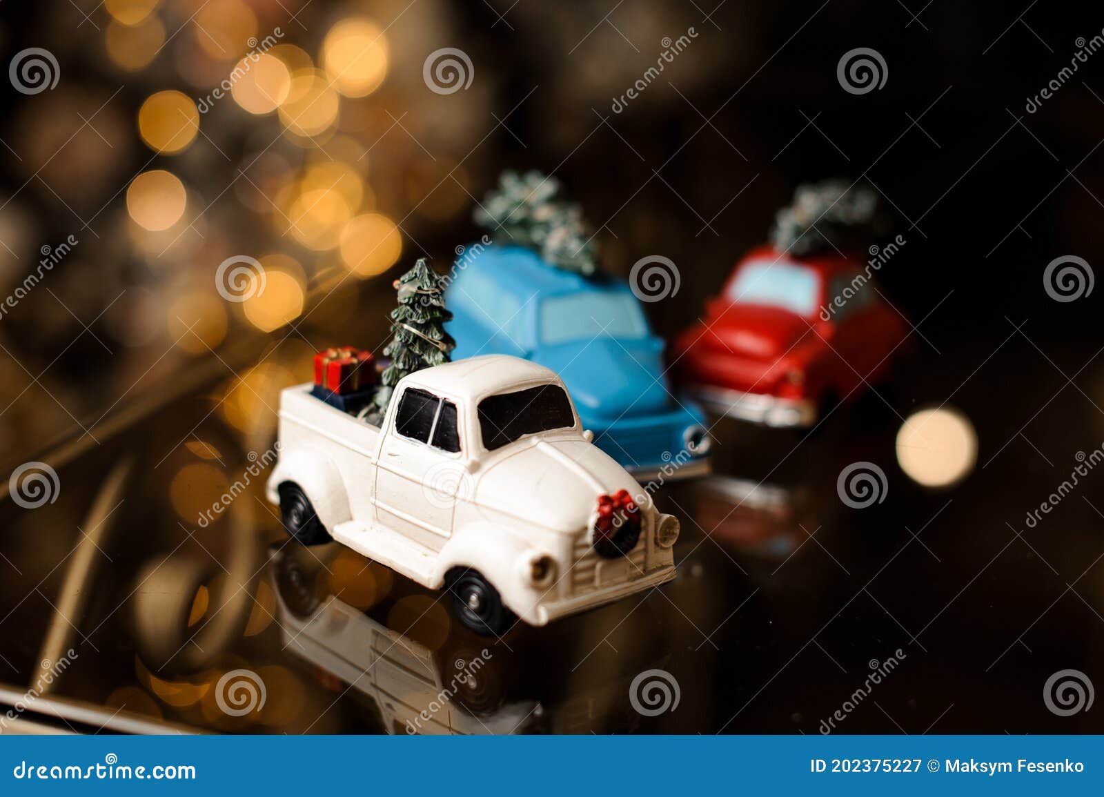 Several Beautiful New Year`s Figures in the Form of Cars are on the ...