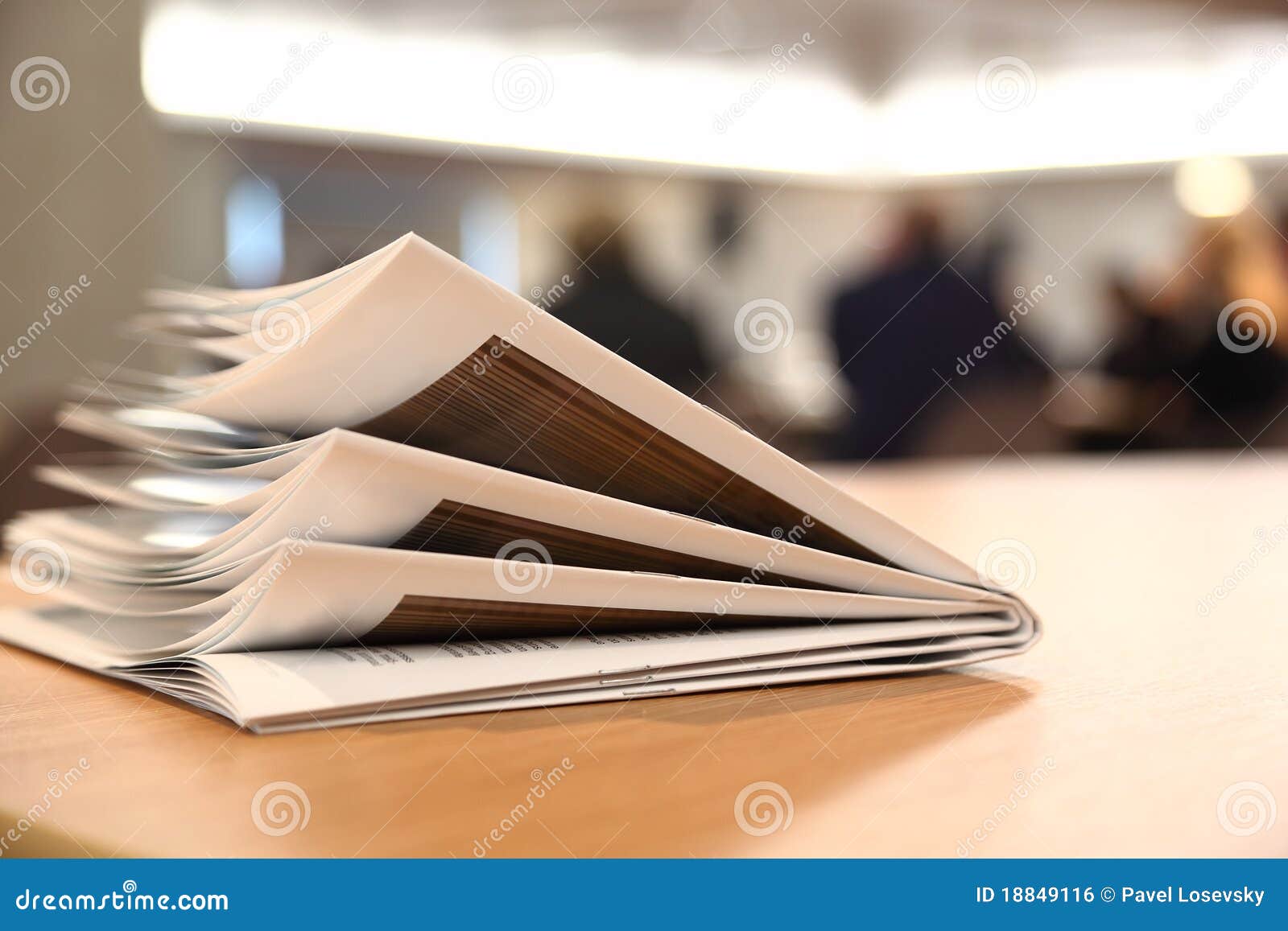 Several Brochures on Light Table in Room Stock Photo - Image of design ...