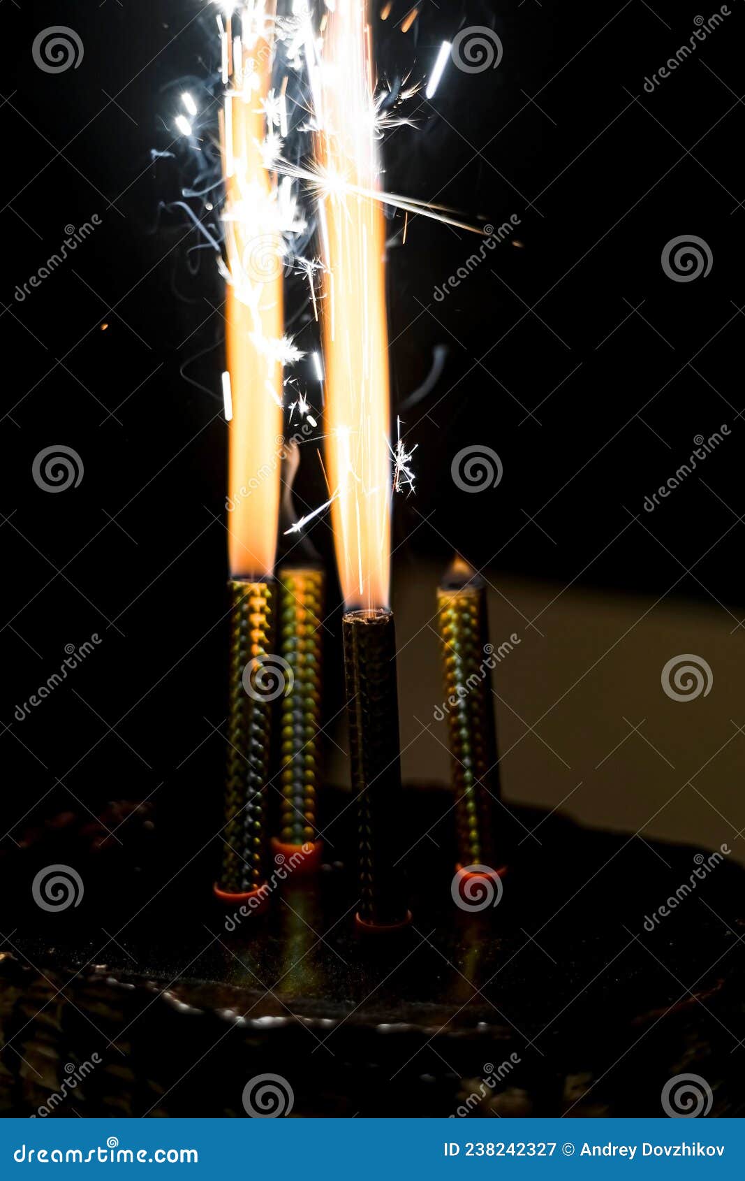 Several Burning Candles are Fireworks that are in the Cake Stock Image ...