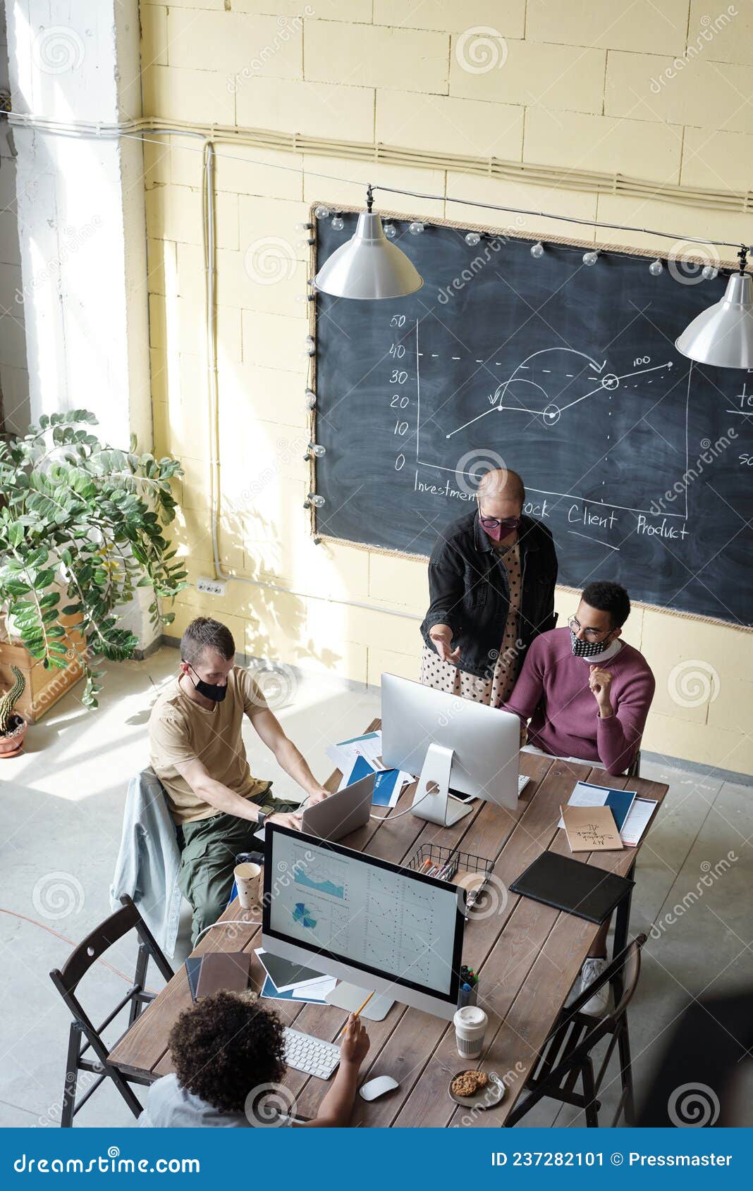 Several Co-workers Looking at Computer Screens during Work Stock Image ...